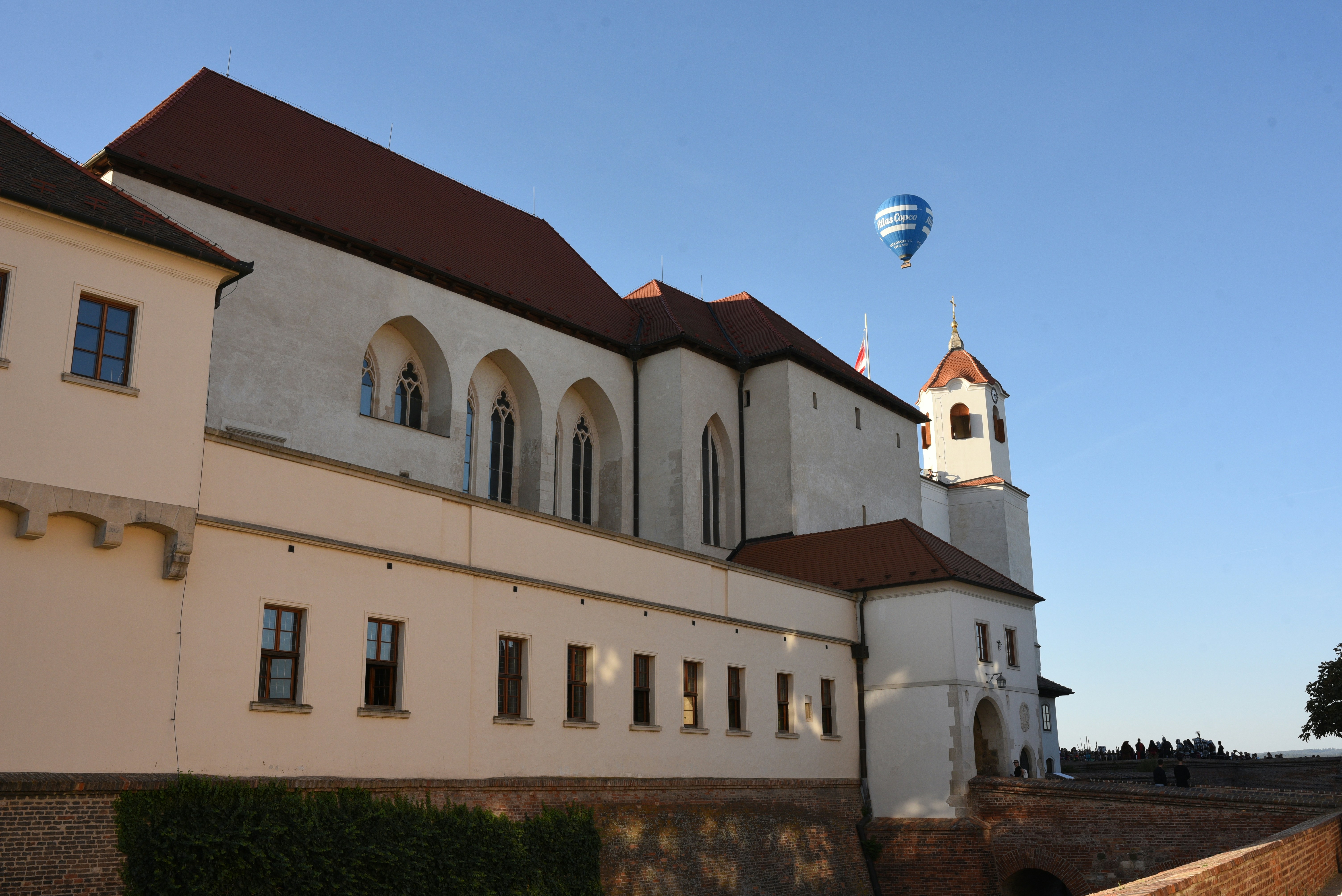 Castle Facade Under a Clear Sky with a Floating Balloon