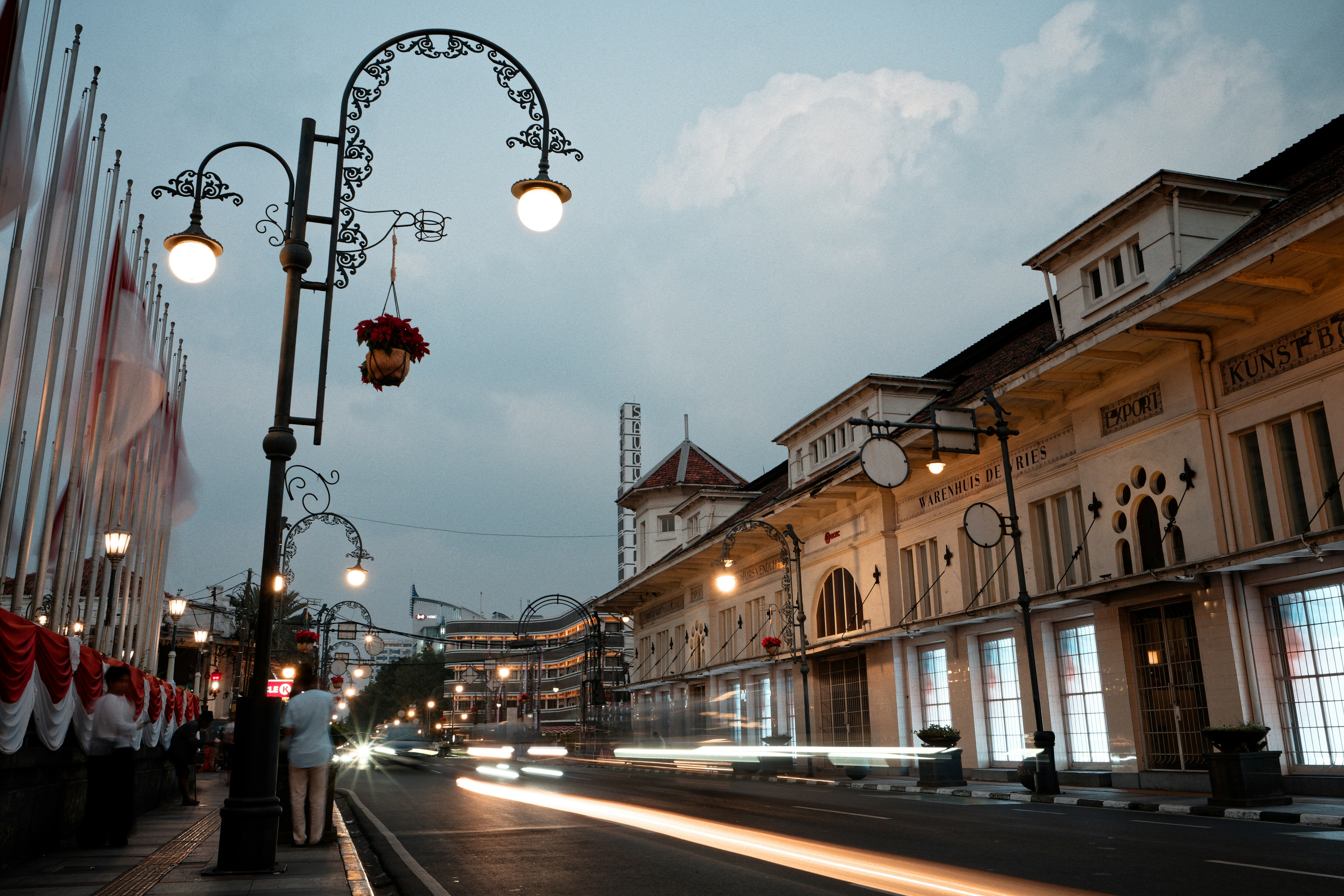 Evening Arcades: Street Lamps and Historic Facades in Motion