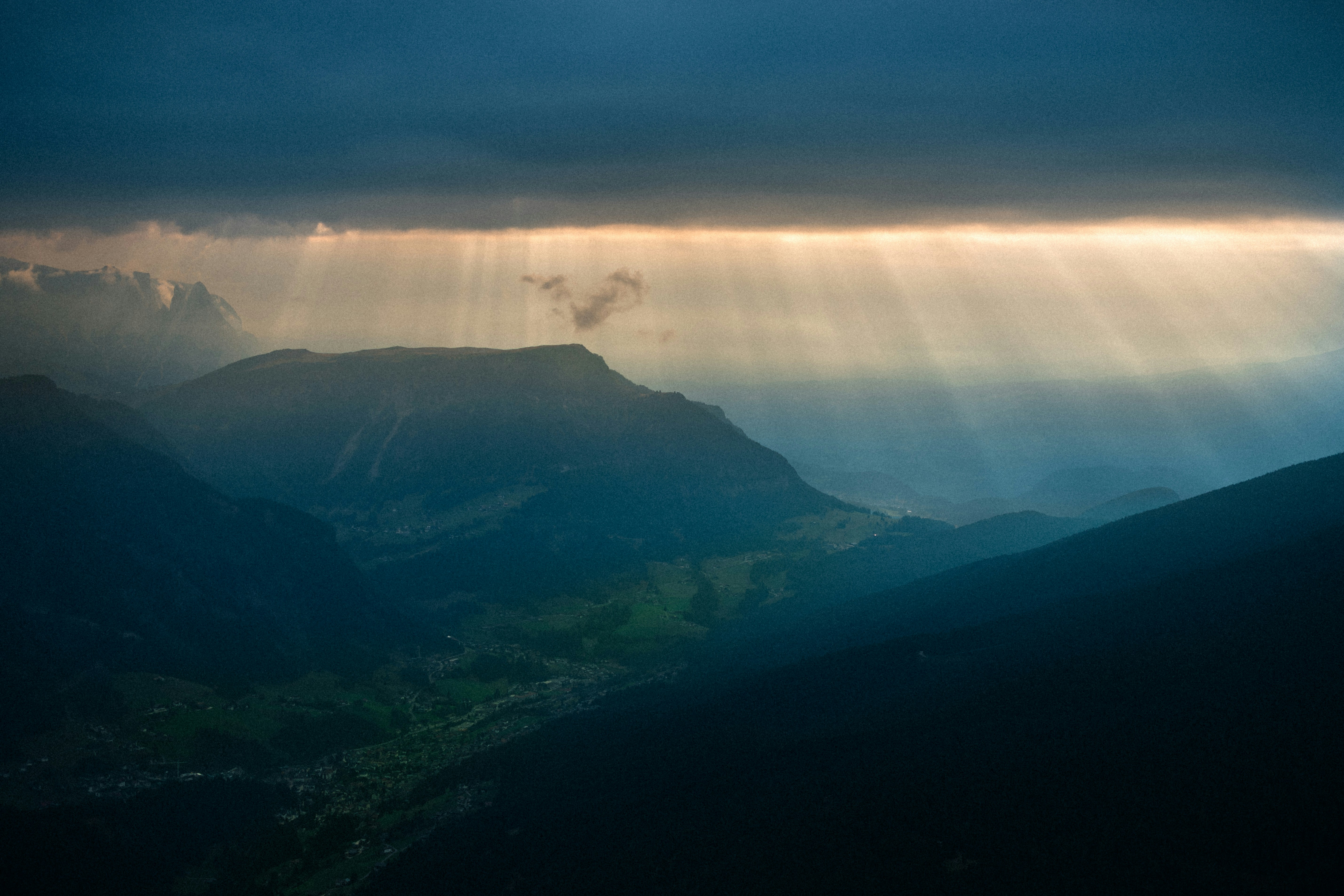 Rays over the Valley: A Mountain Pass Bathed in Breakthrough Light