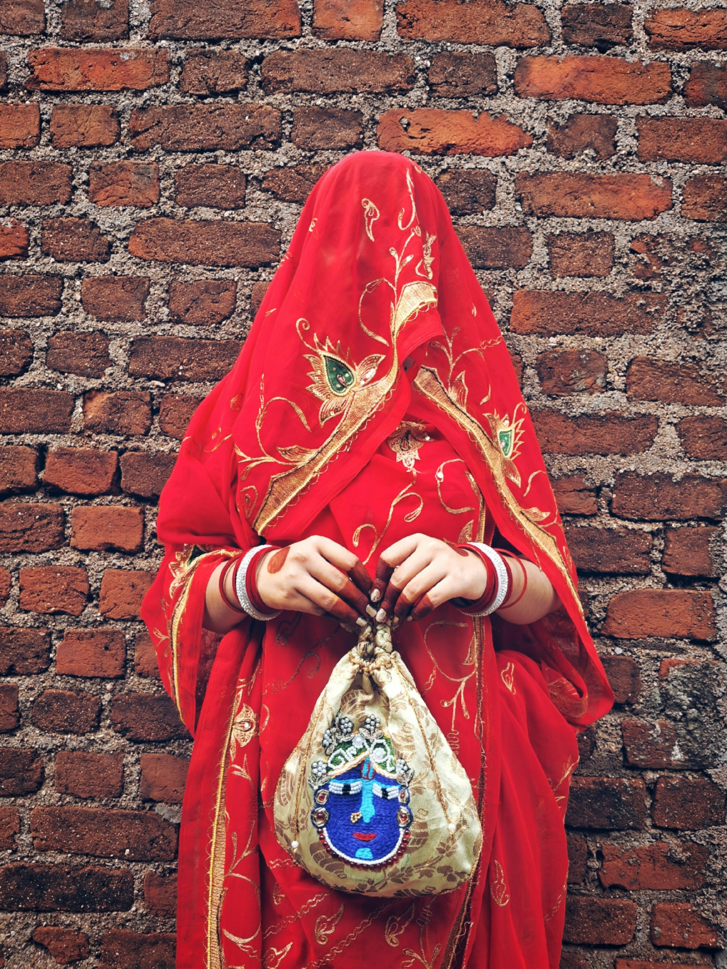Burqa of Red Embers: Hidden Face in a Painted Veil
