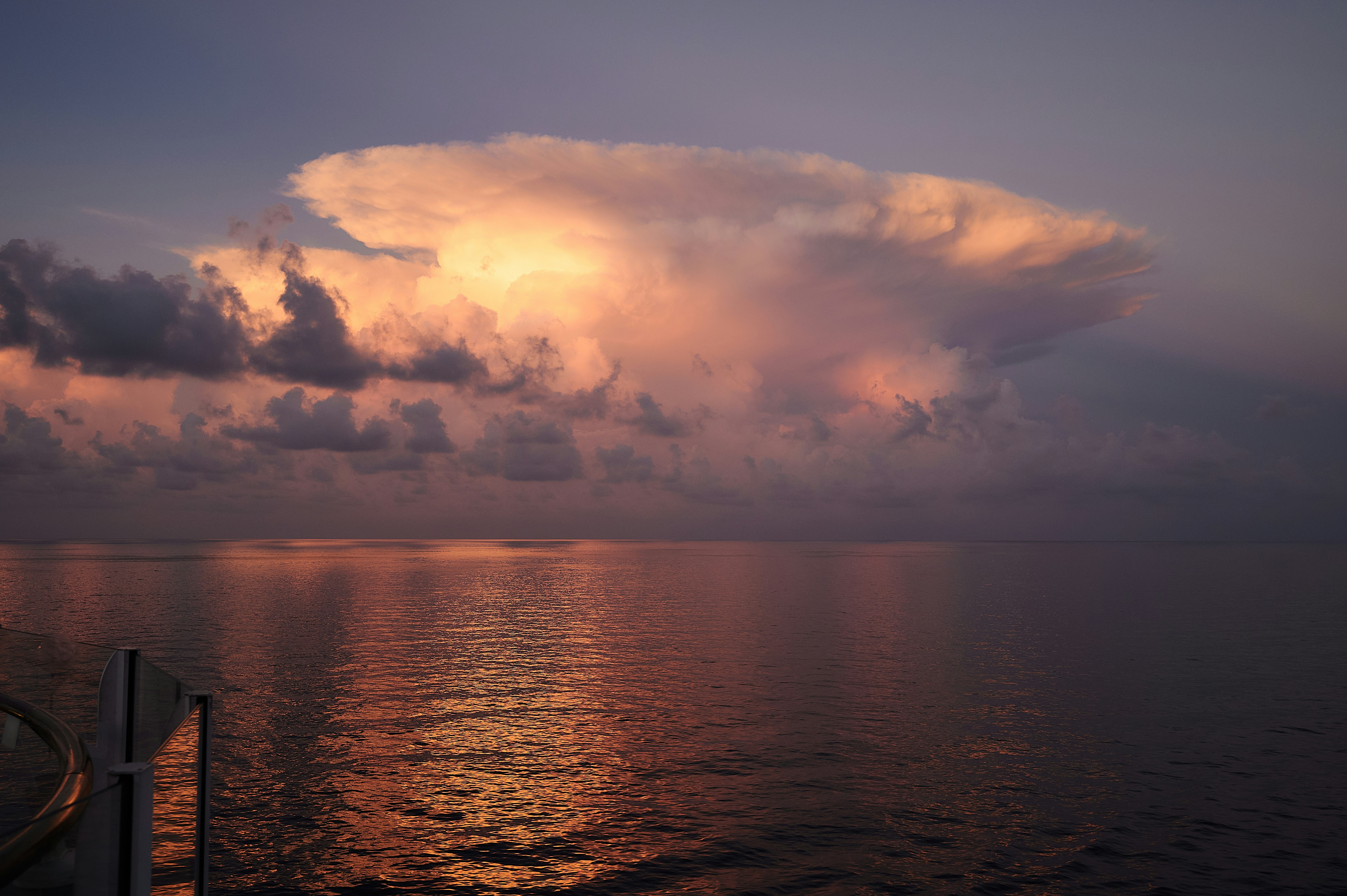 Sunlit Cloudbank Over Quiet Horizon