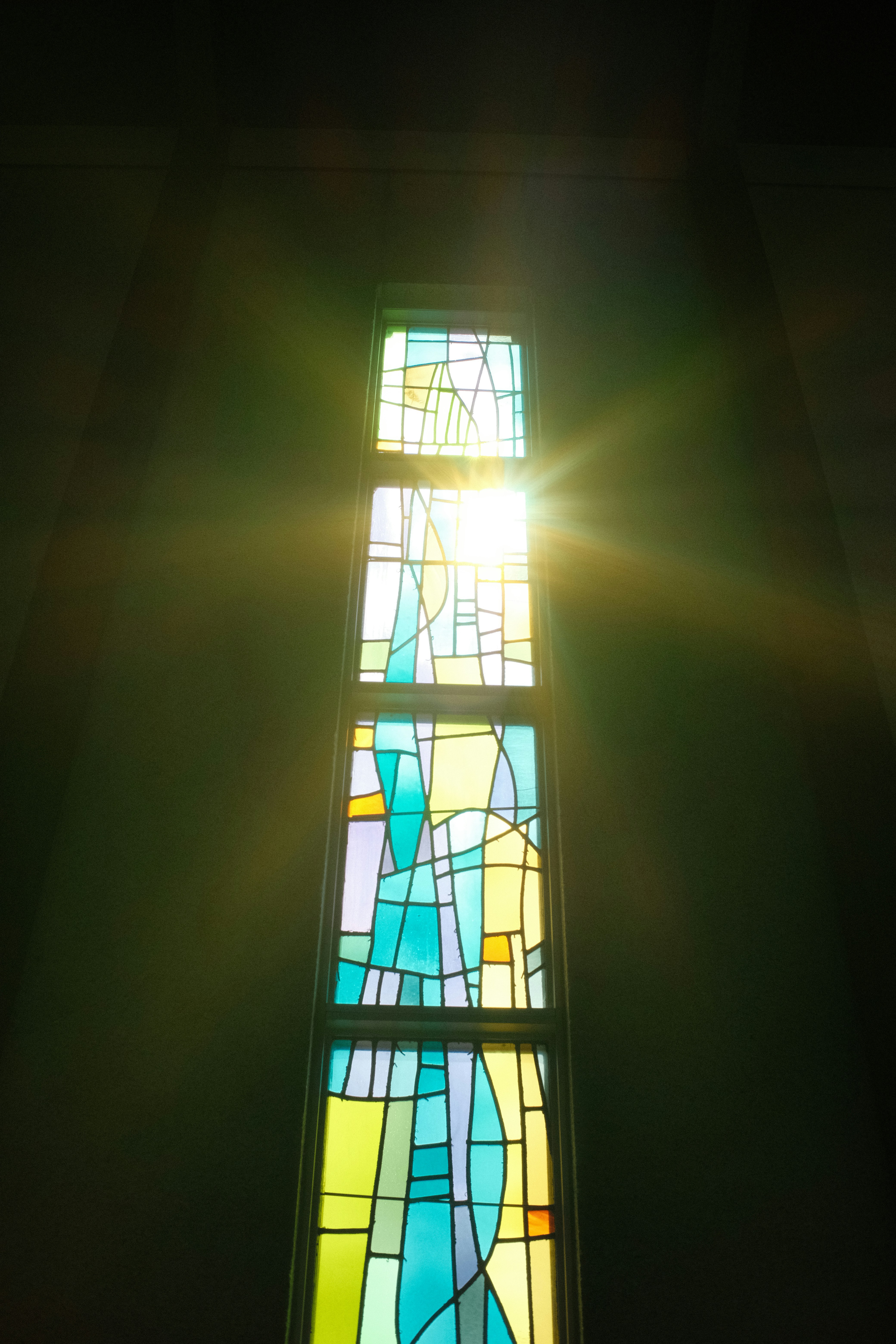 Stained Light Window: Sunburst Through Colored Panels