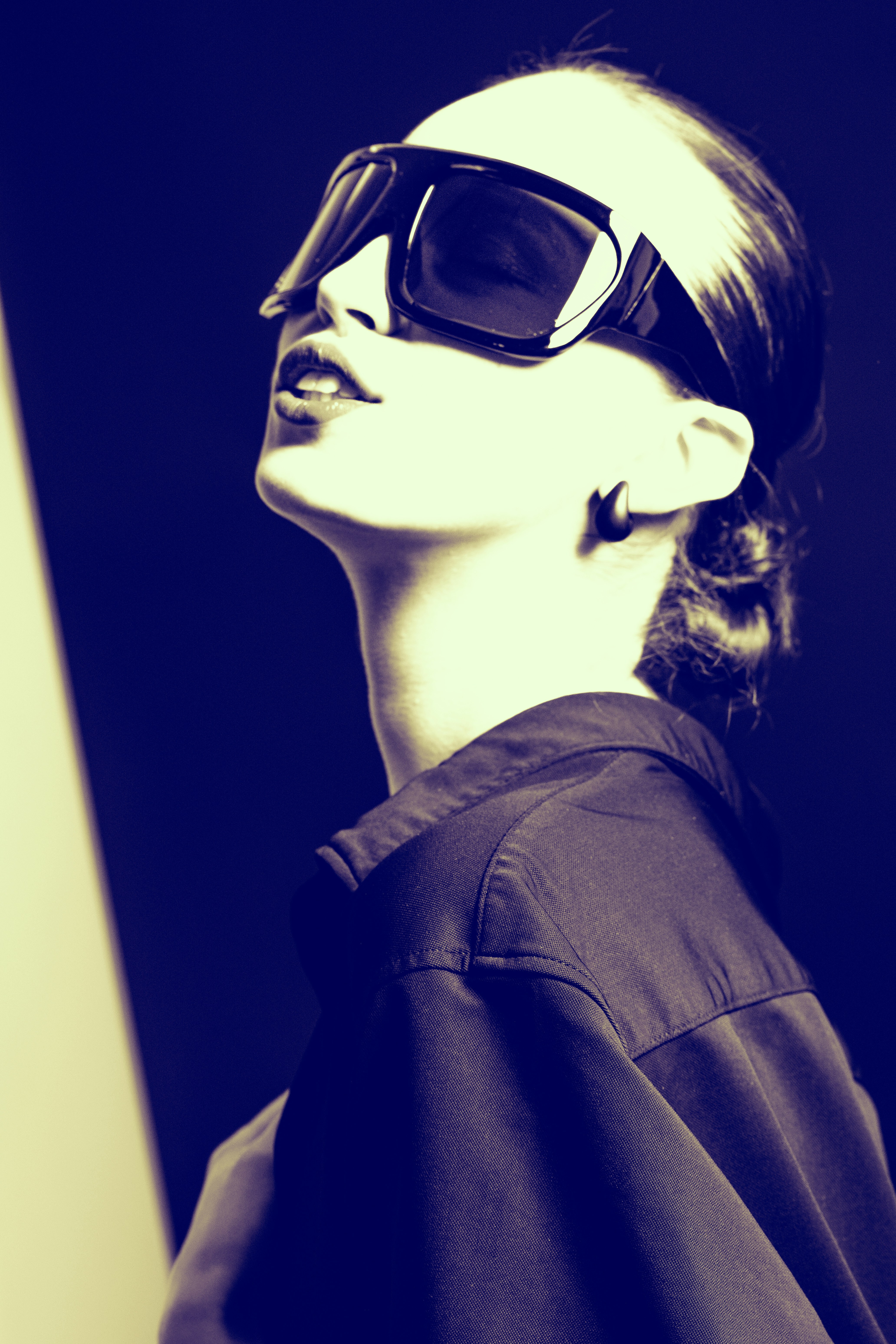 Neon Silence: A Sunglasses Gaze in Violet Light