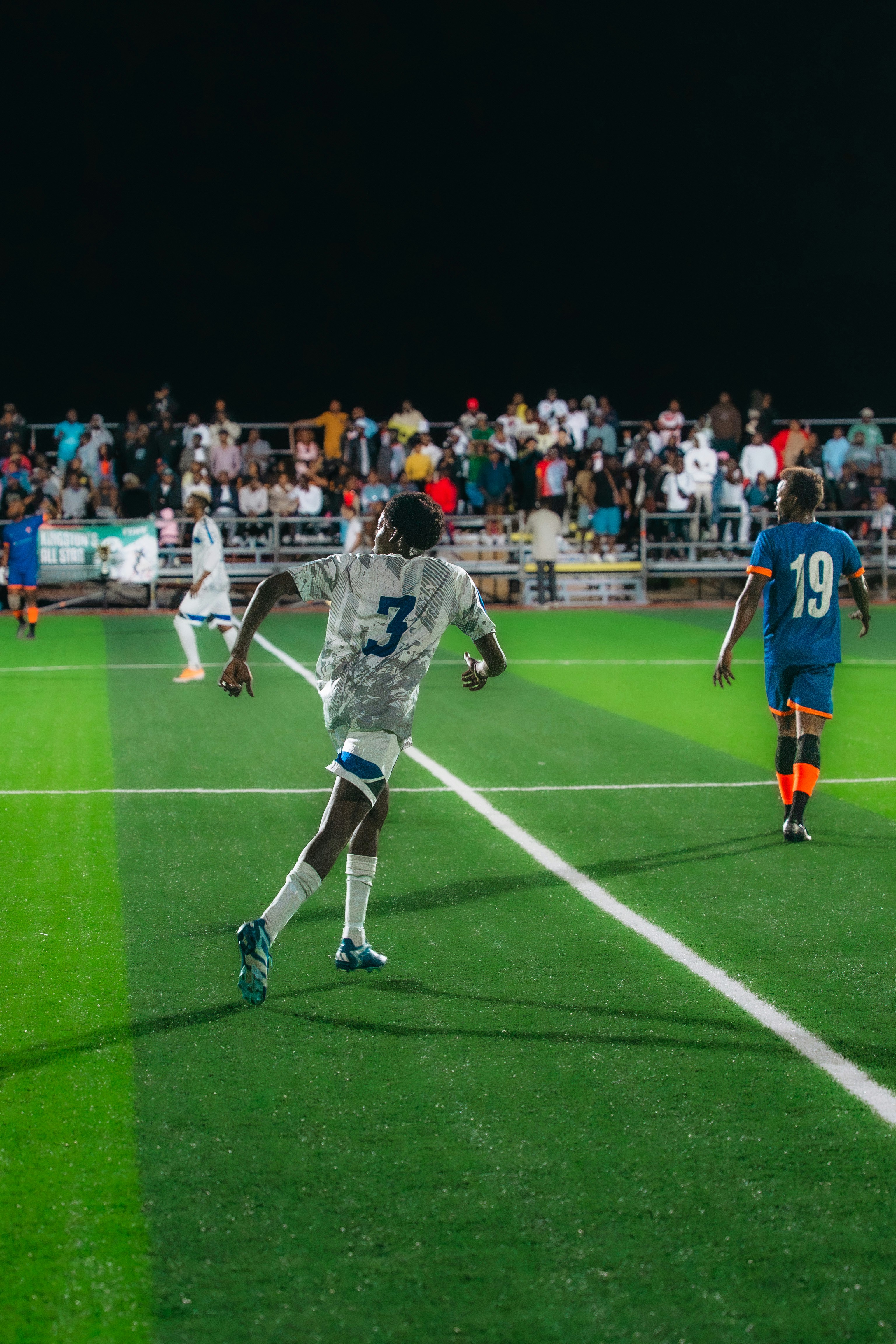 Mid‑field Sprint Under Stadium Lights