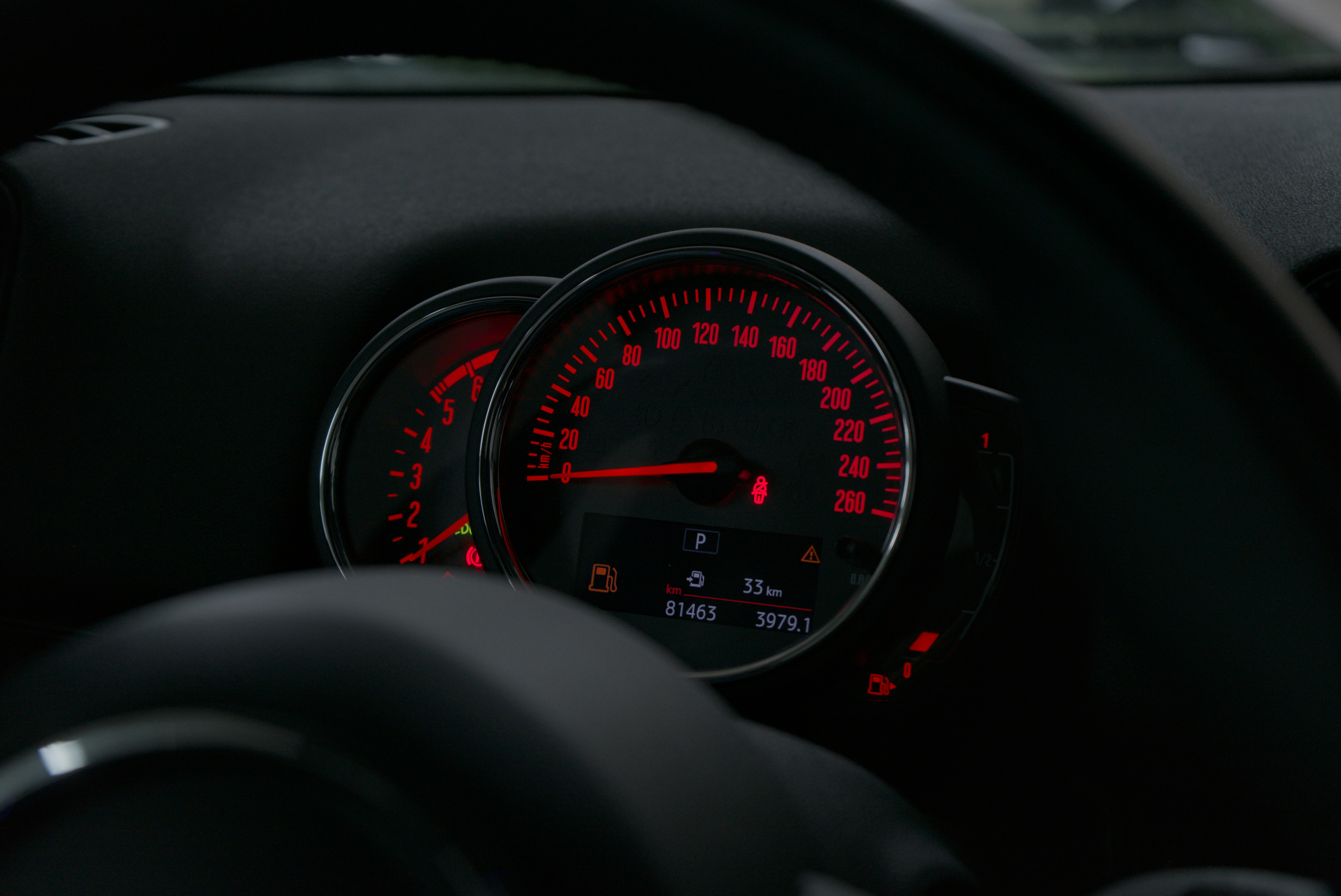 Red-lit Tachometer Pulse: A Steady Drive Through Dim Cockpit Light