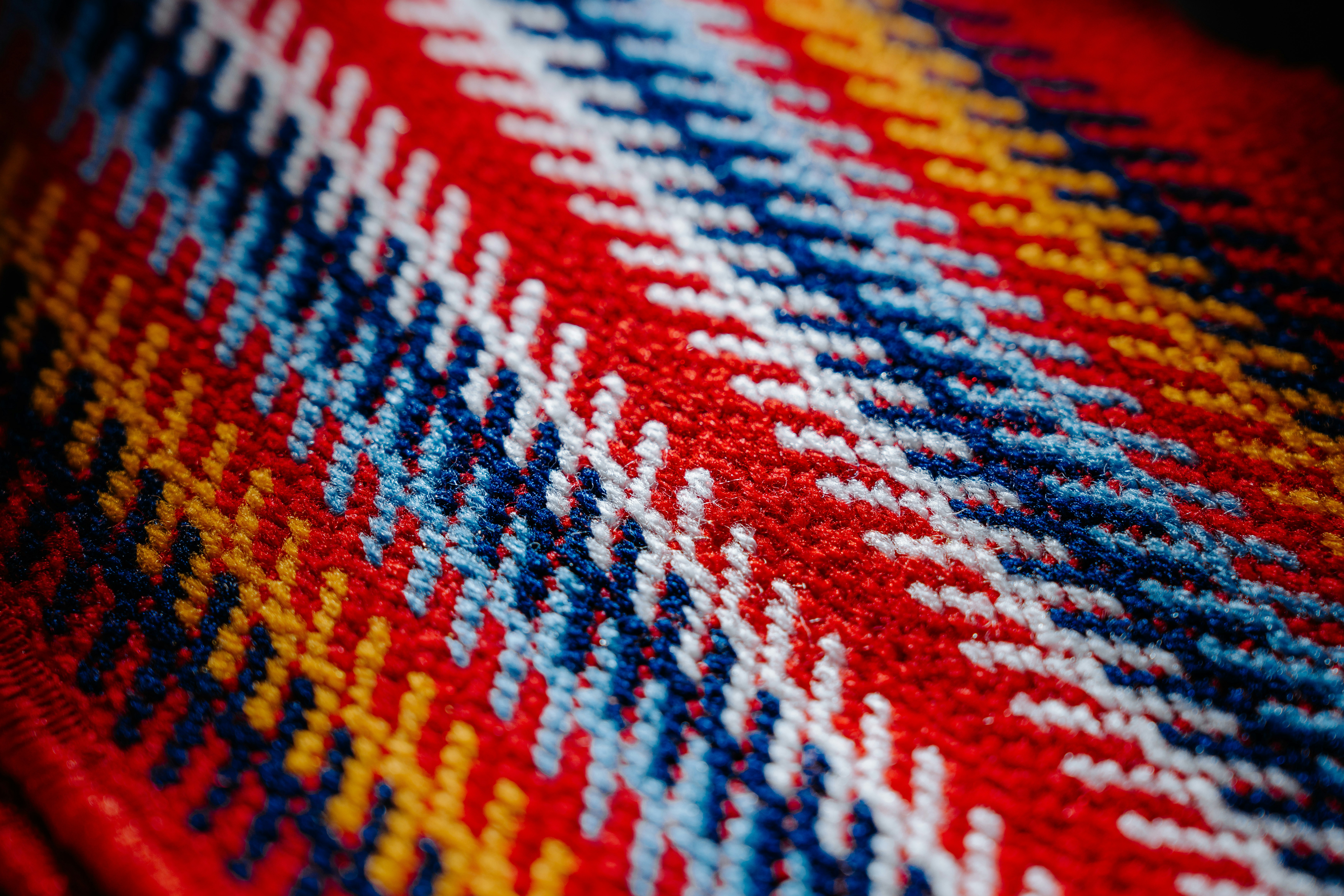 Crimson Threads Across a Loom of Color