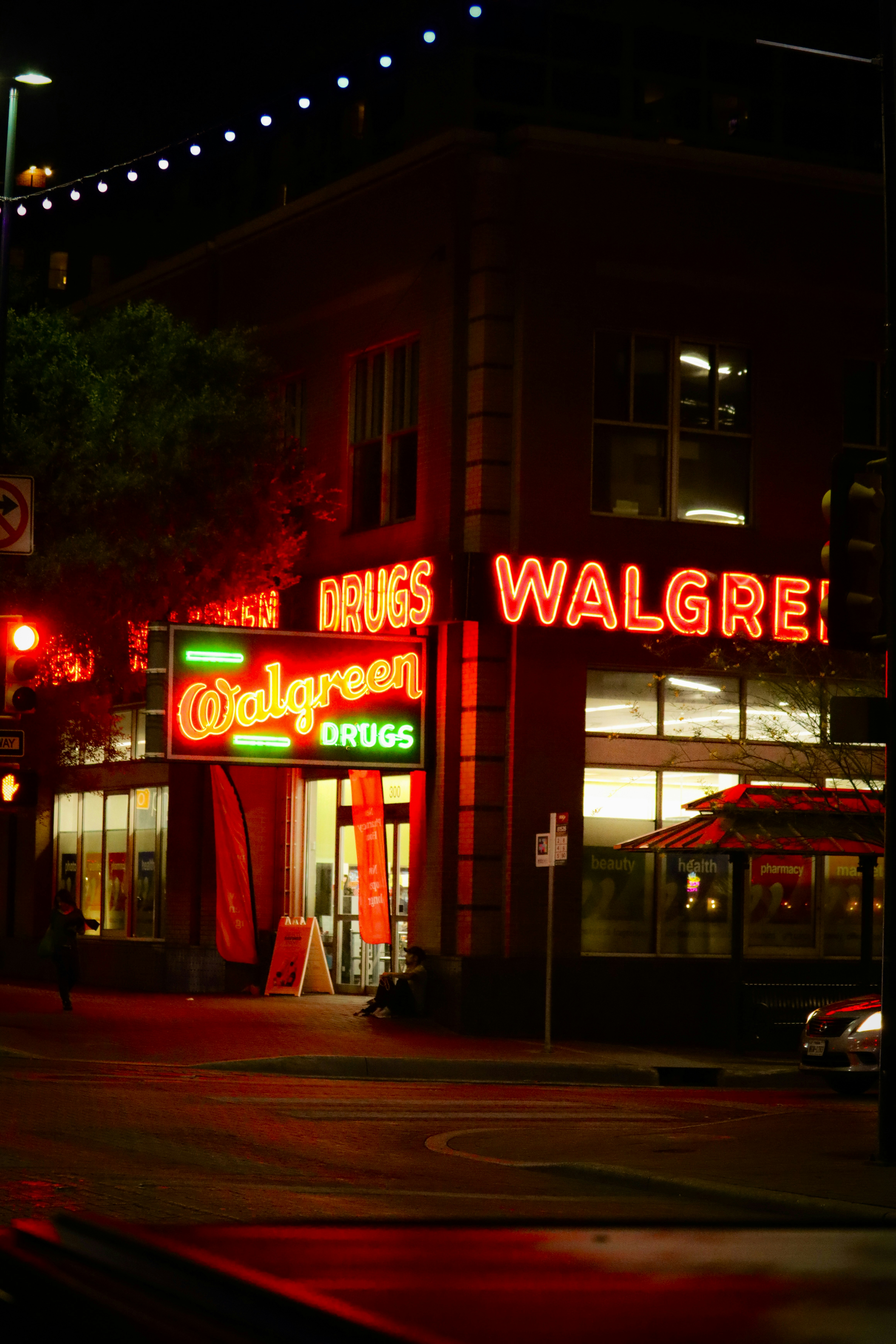 Neon Pulse on a Night Street: Walgreens Glow and Red Sign