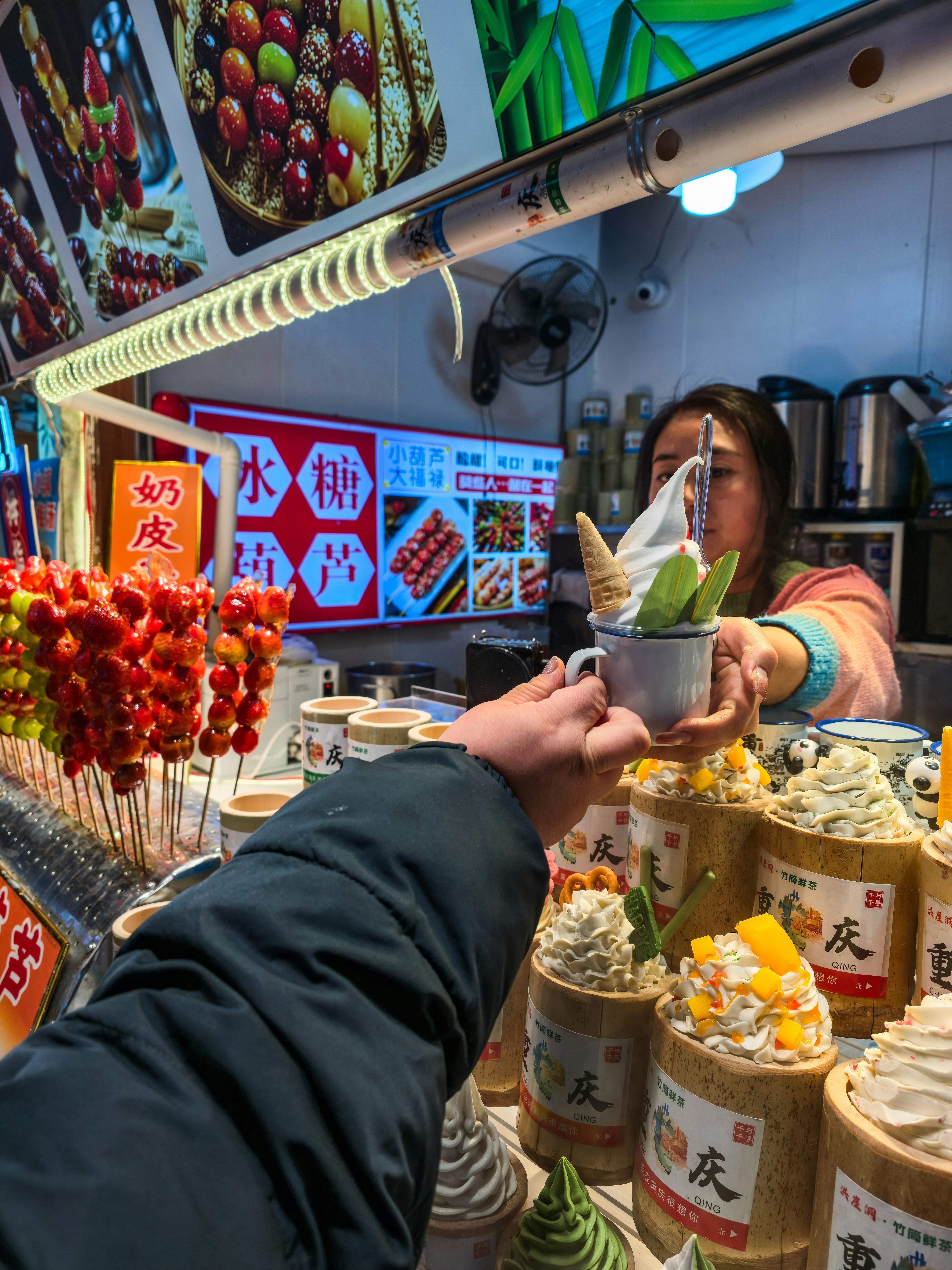 Sweet Skewers and Whipped Delights at a Bustling Market Stall