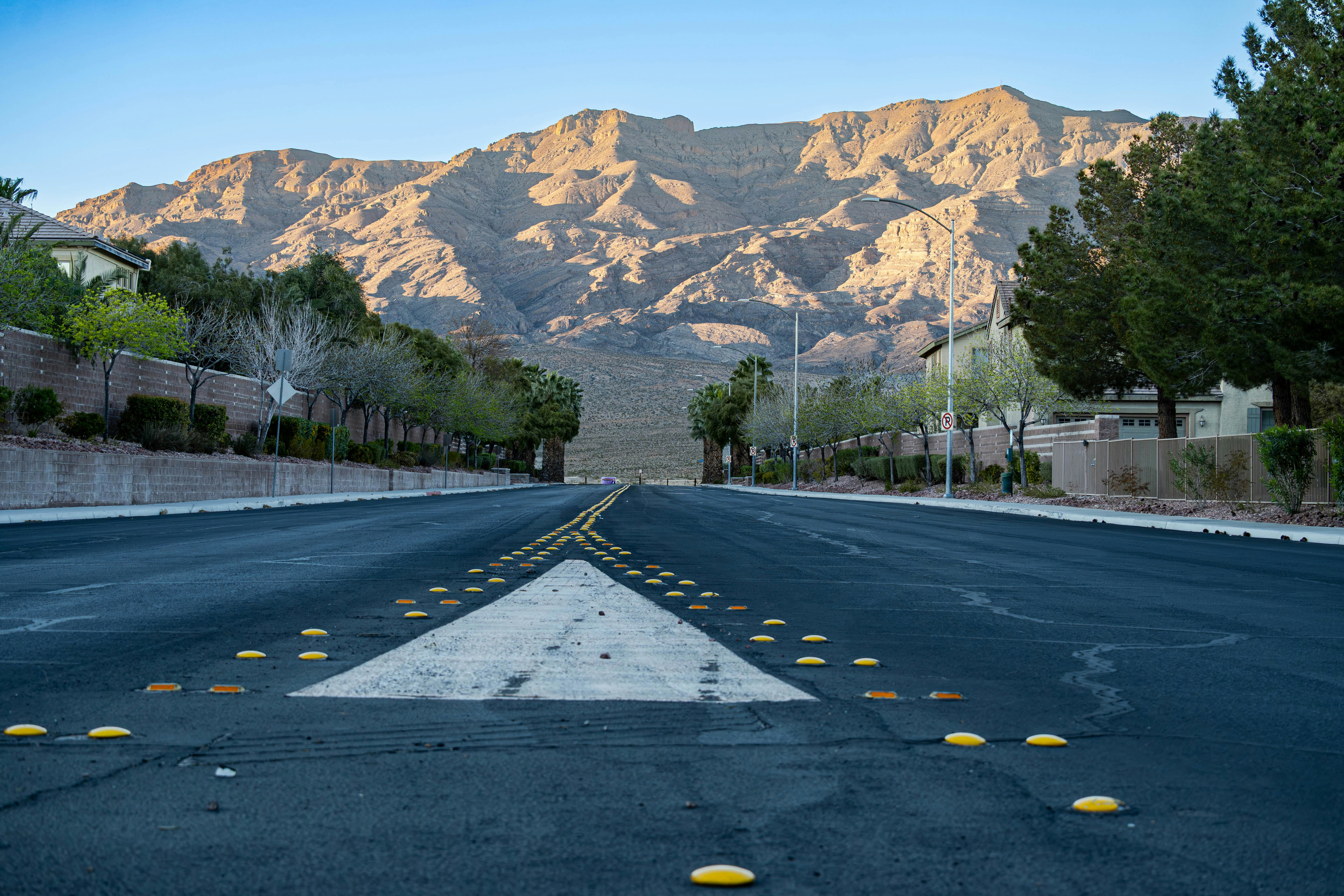 Aisle to the Basin: Desert Road Summit Under Rocky Skies