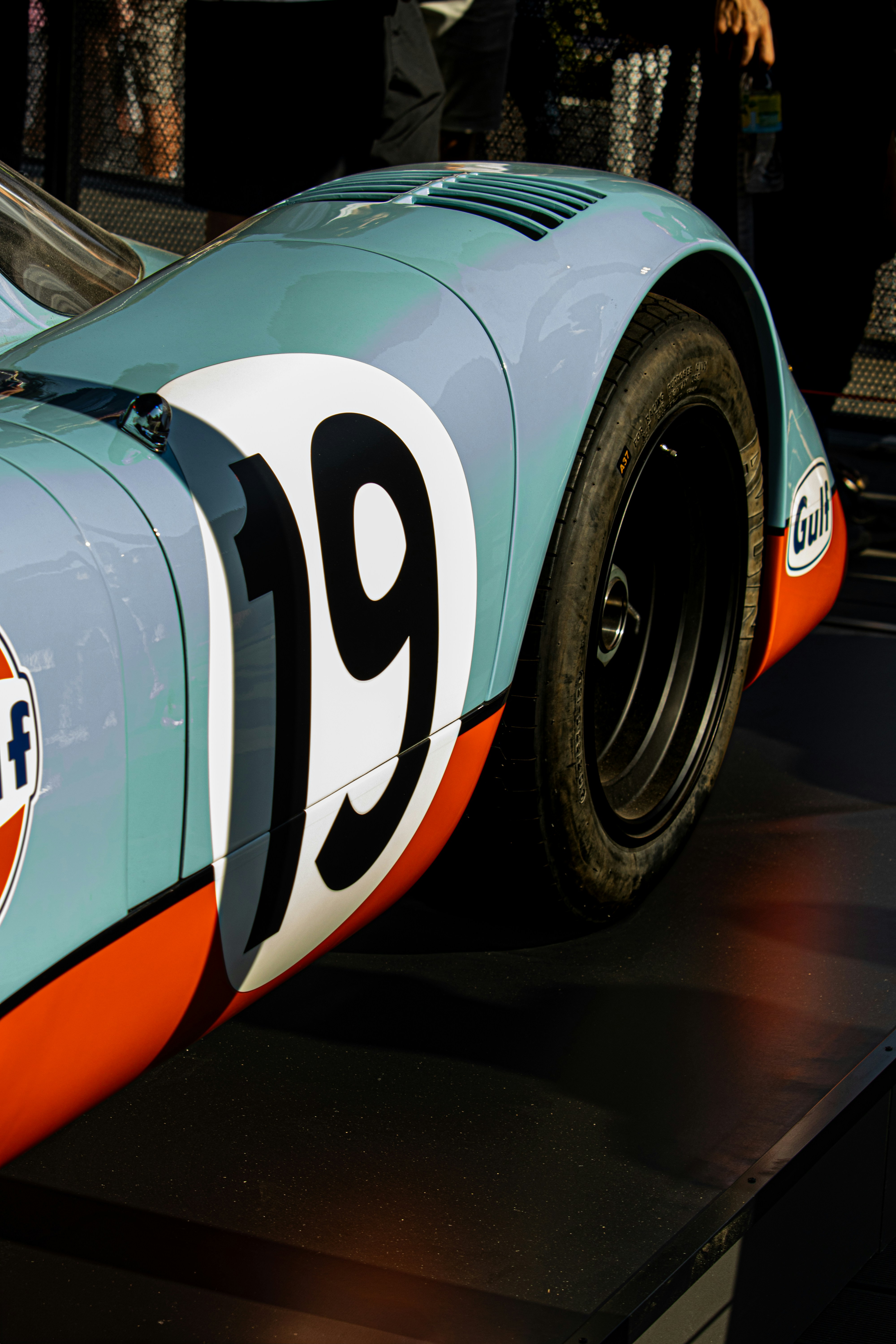 Turquoise racing silhouette: number 19 in a vintage Gulf livery