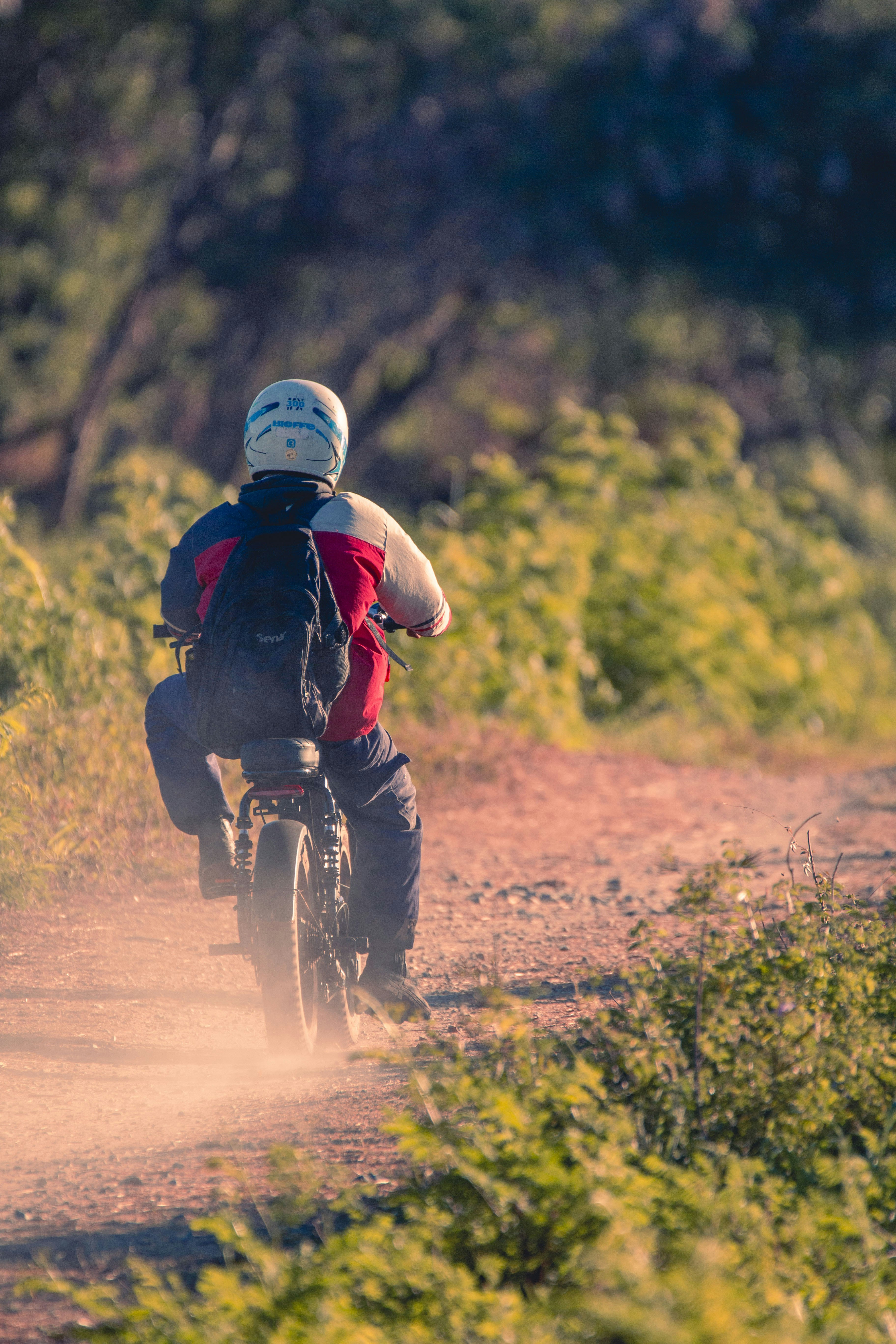 Rider in Red: A Back-View on a dusty trail