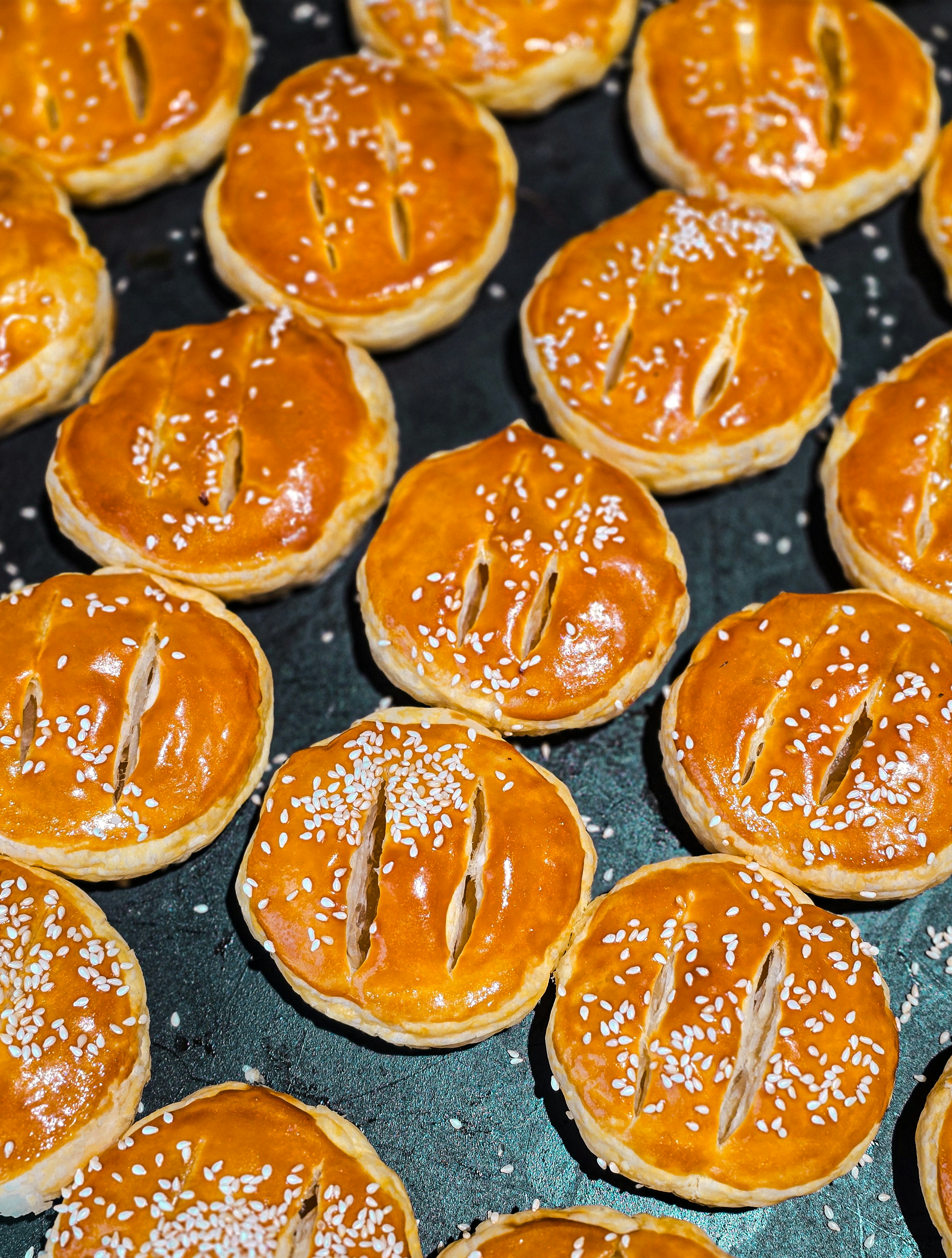 Golden Baked Savory Pastry Rounds: Sesame-Seeded Treasures