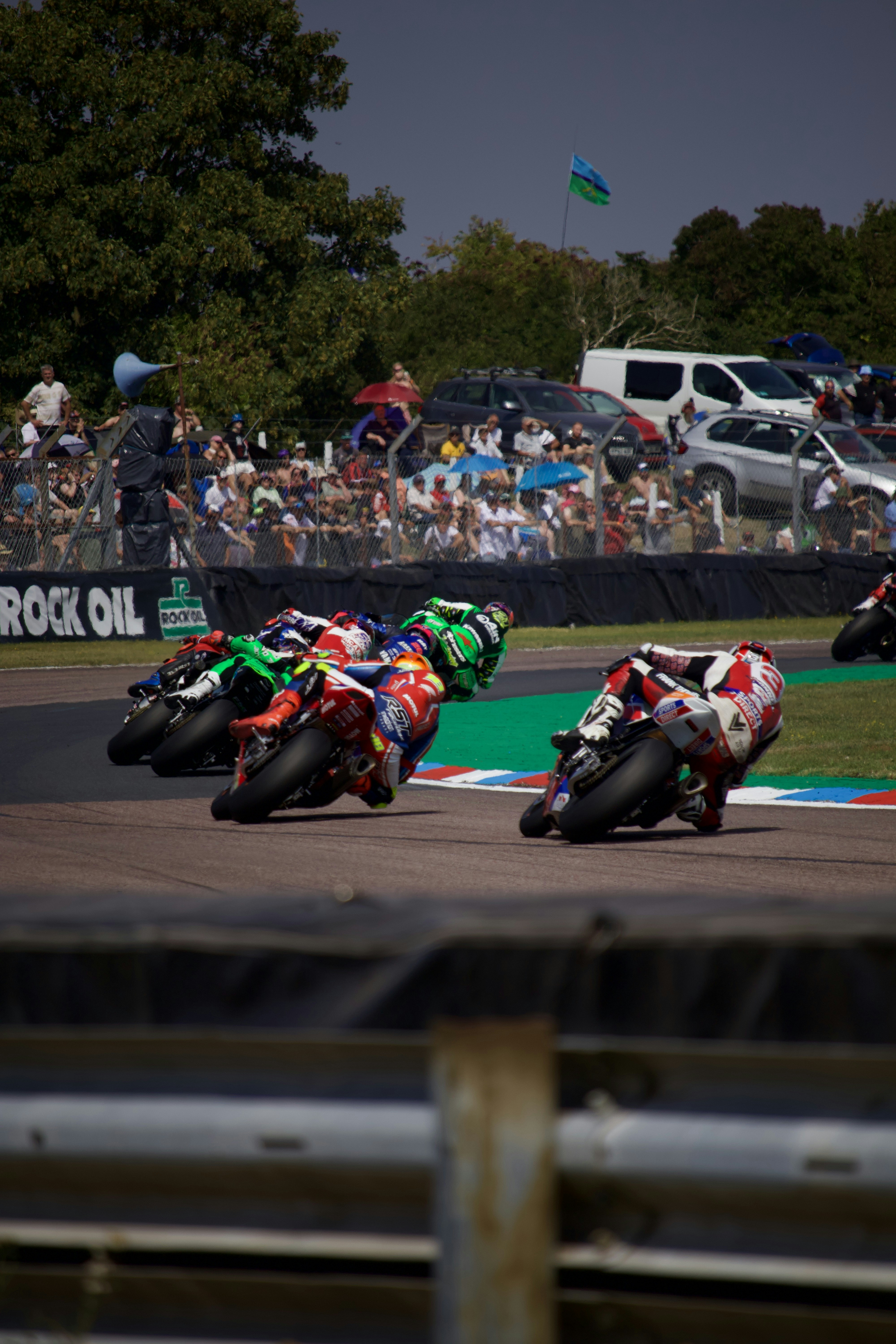 Racing Arc: Tilted Herd of MotoGP at Corner Exit