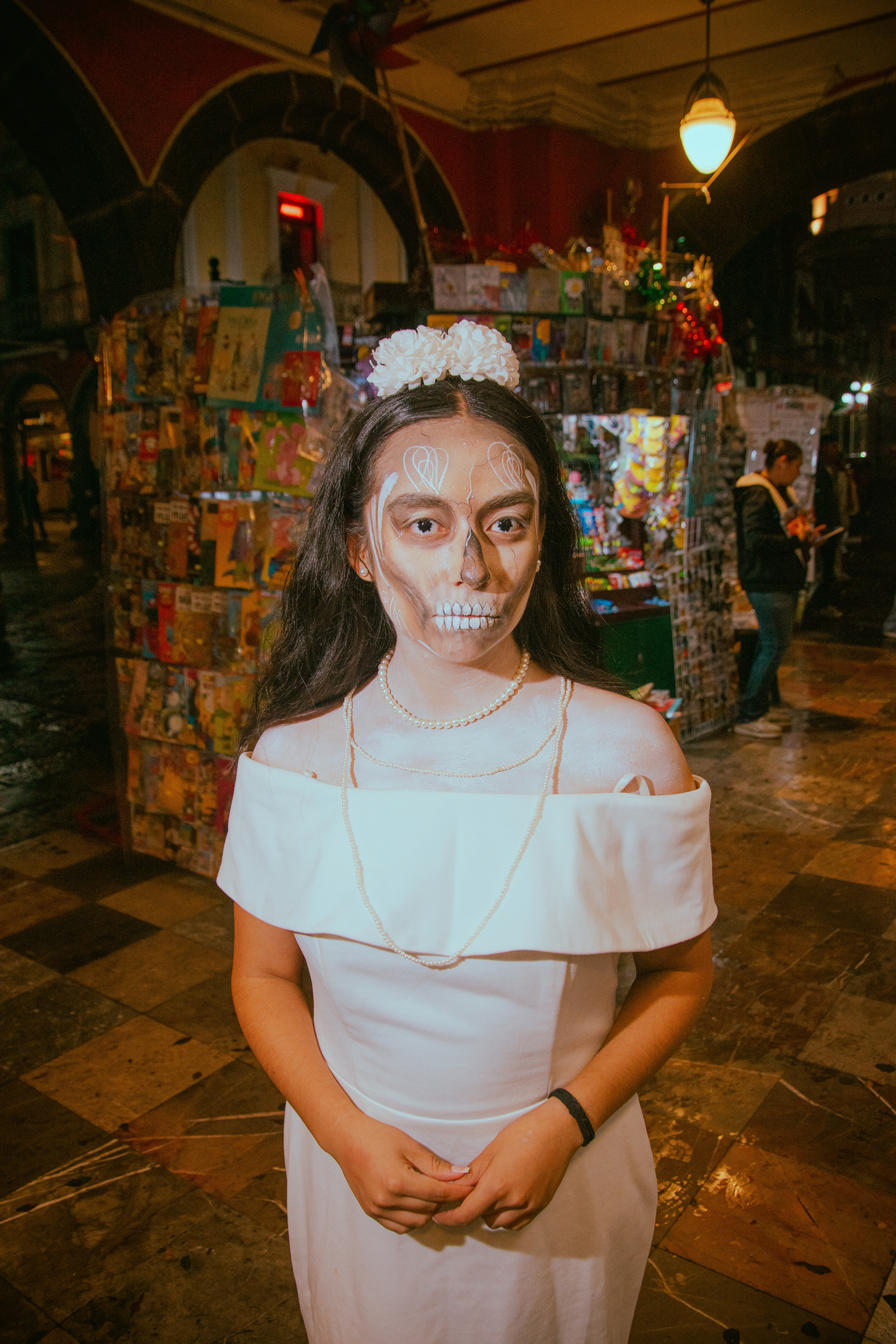 Dia de Calavera: White Dress in a Market of Quiet Glow