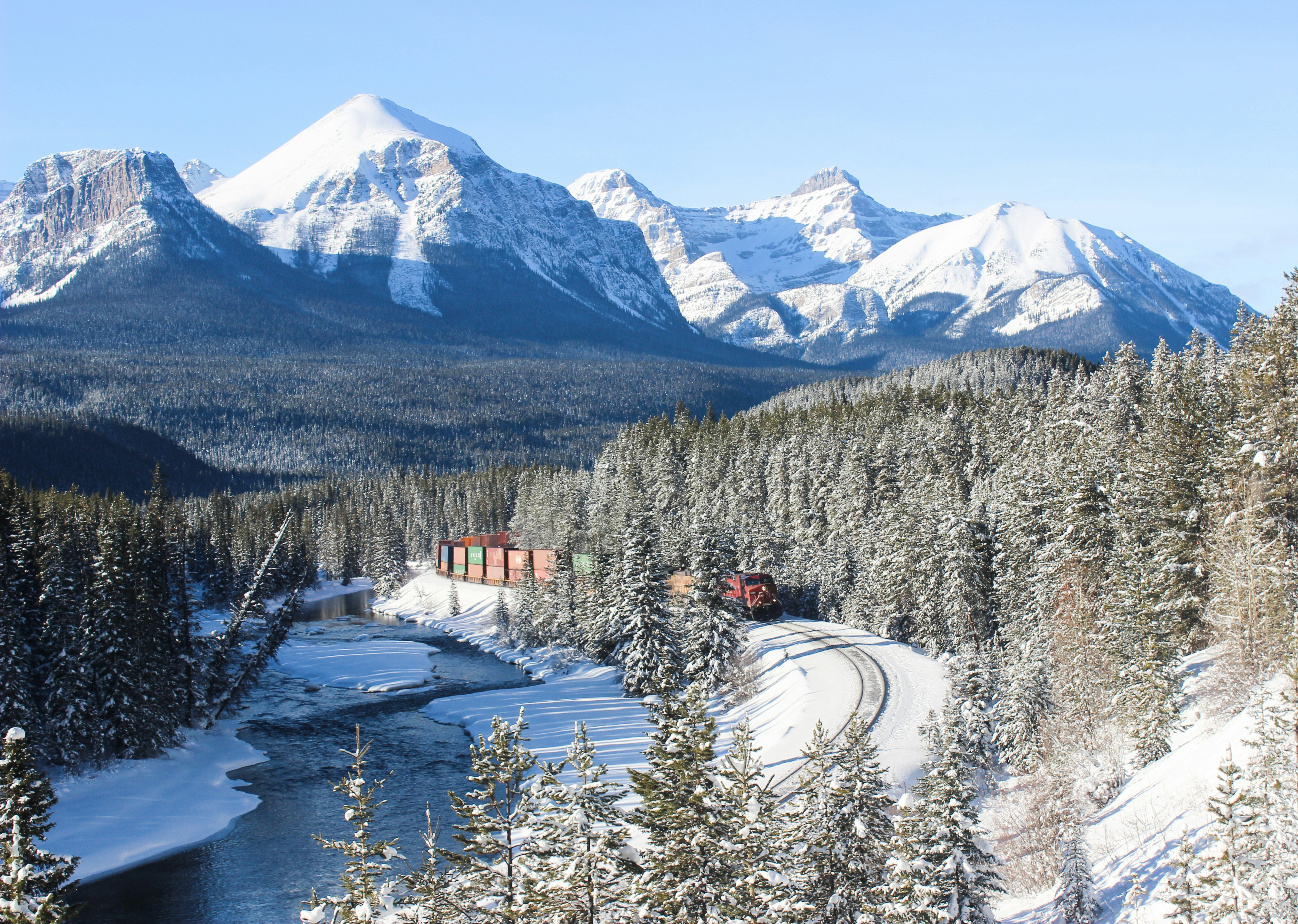 Snowbound Ridge Train: A Winter Cascade Beneath Jagged Peaks