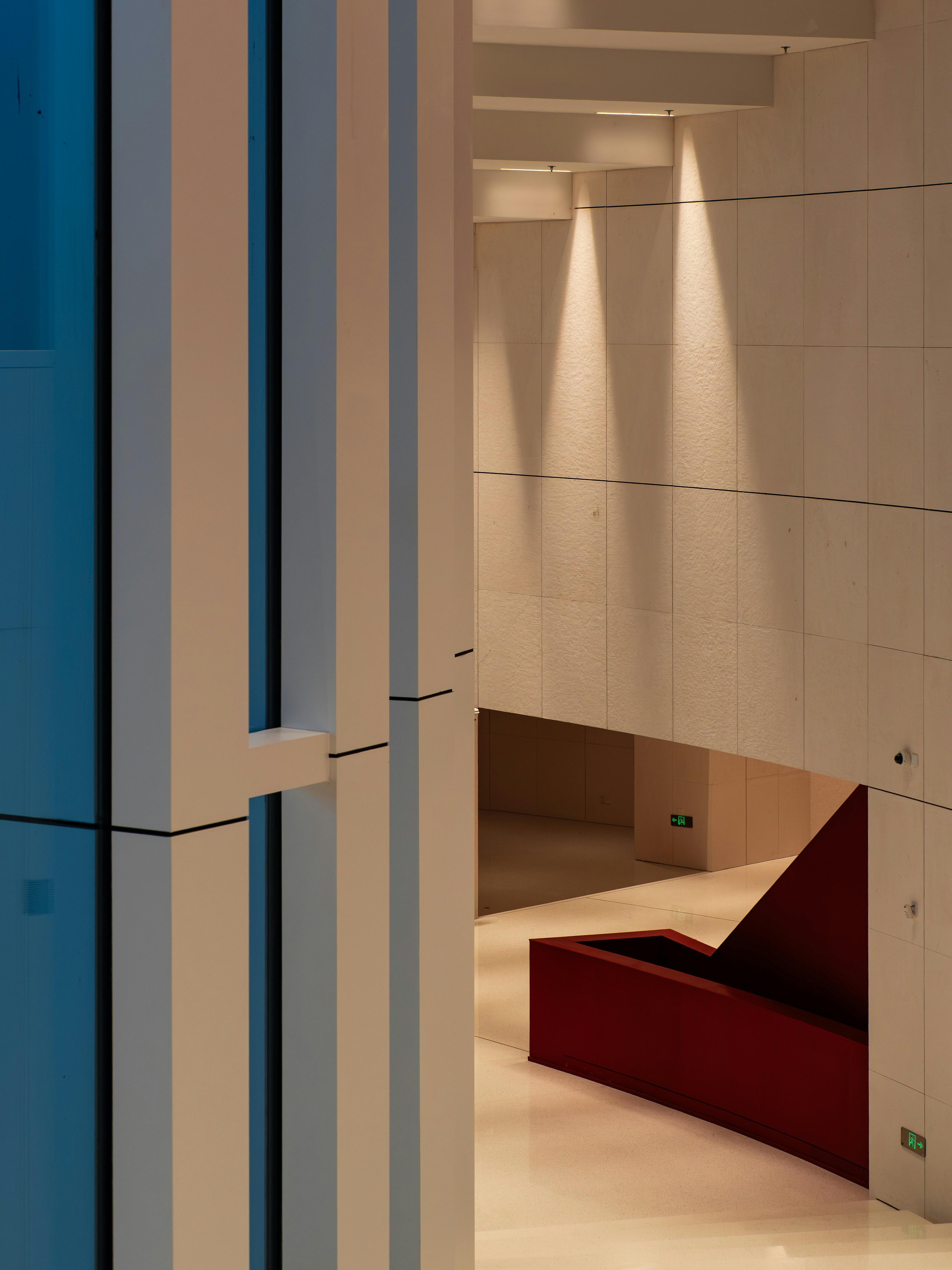 Echoes of Vertical Light in a Minimalist Atrium