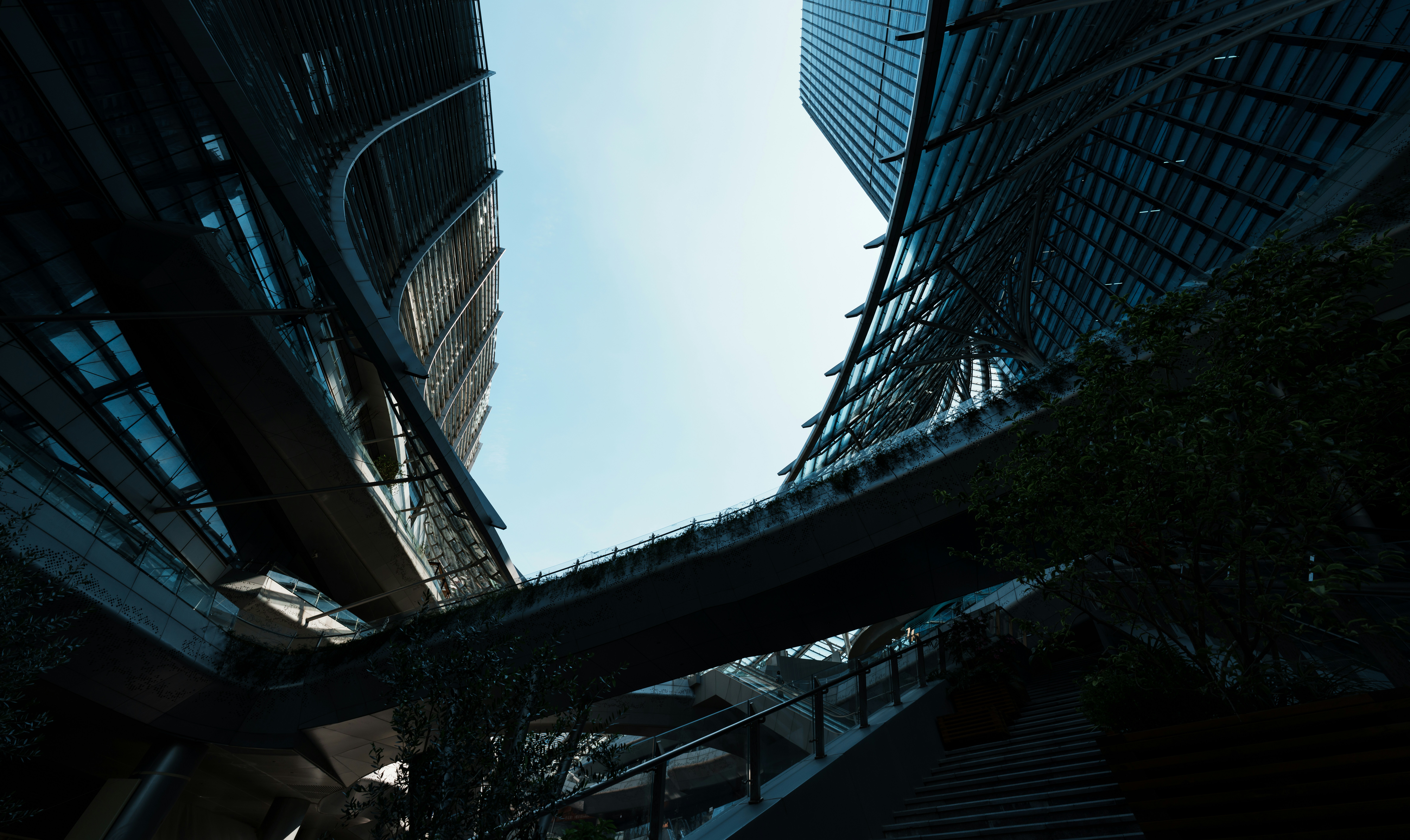 Skyward Confluence: Bridges and Towers Loom Over a Symphonic Urban Canyon