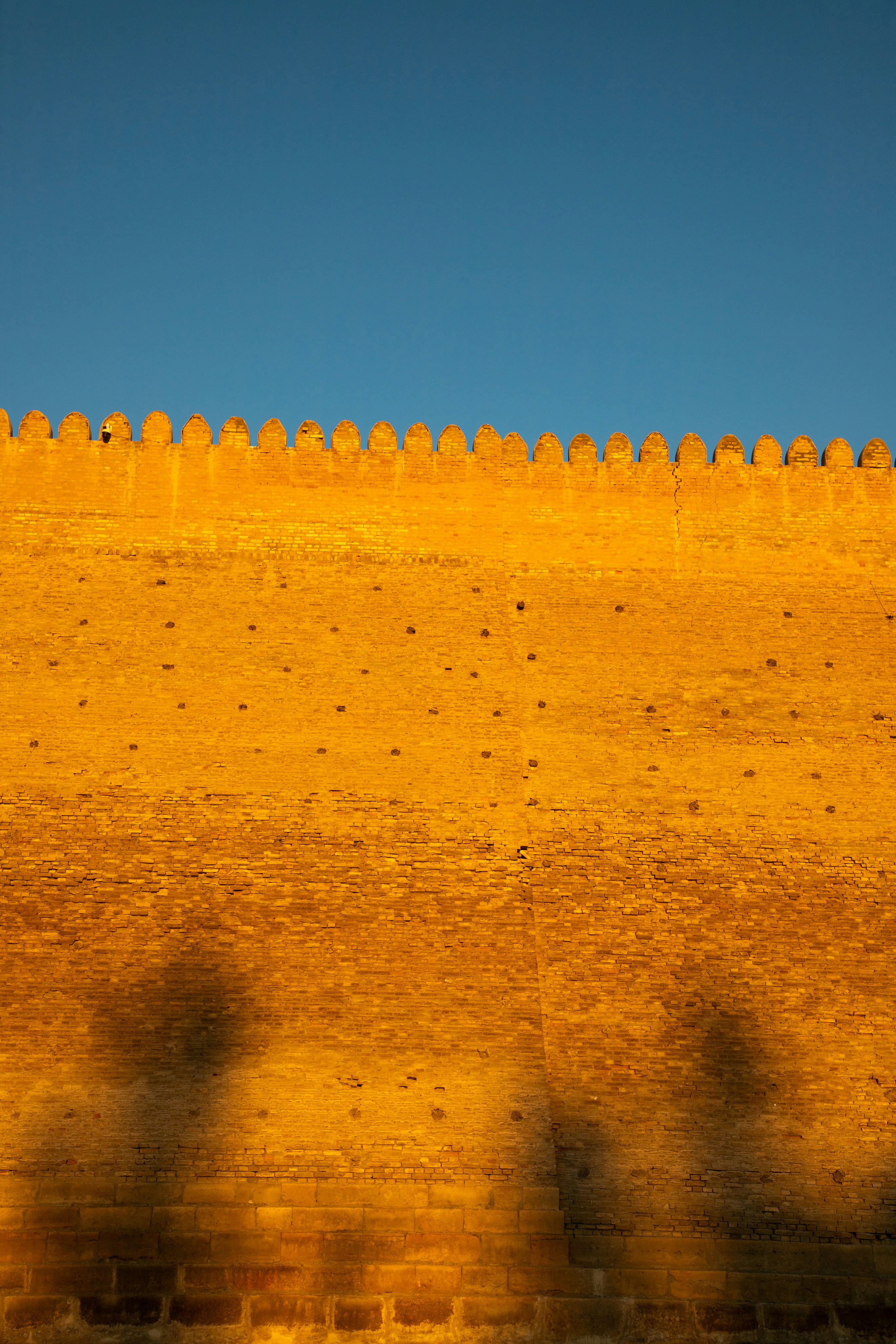 Golden Citadel at Dusk: A Moorish Rampart Basked in Warm Light