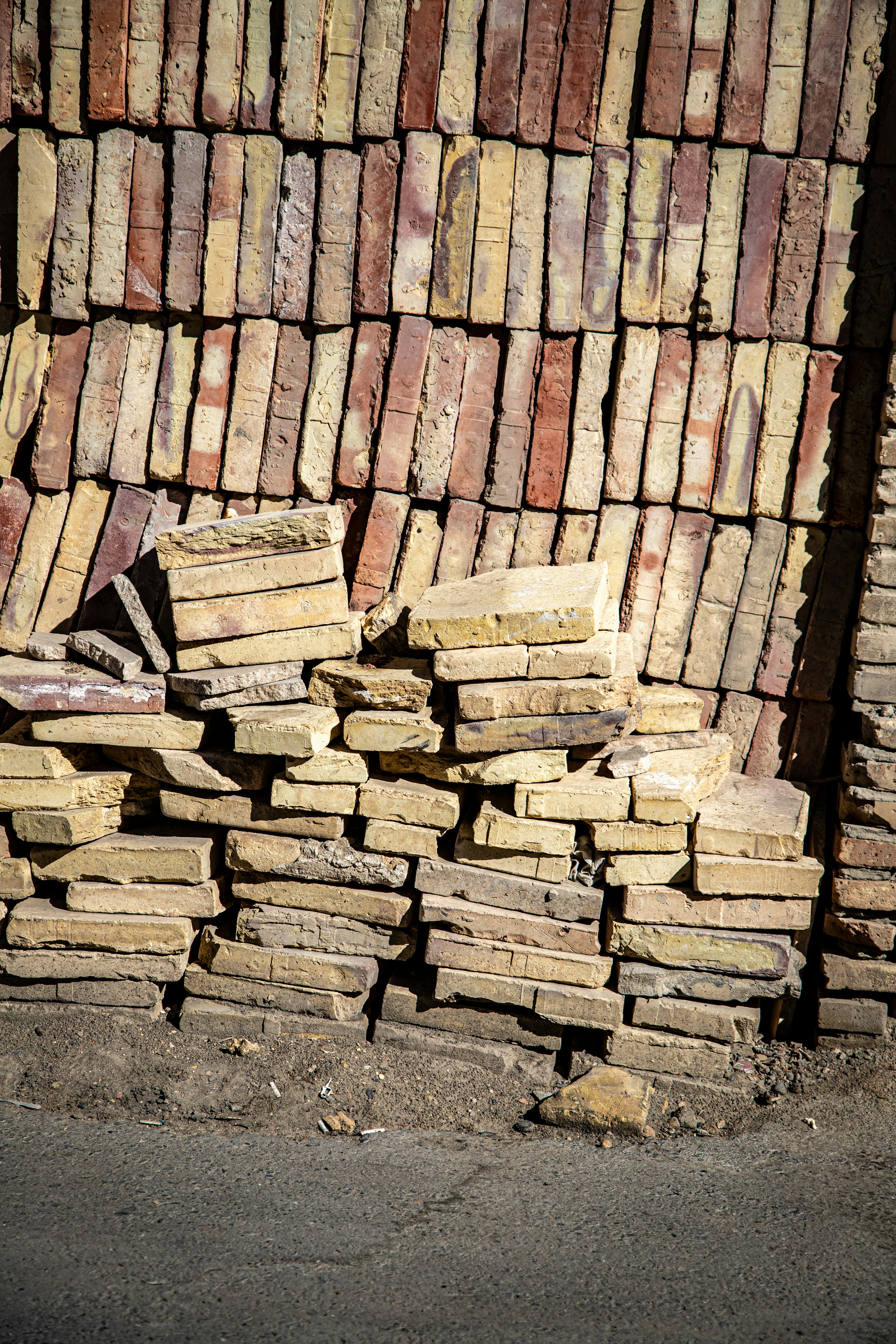 Brick Stacks: Weathered Colorful Blocks Against a Grounded Wall