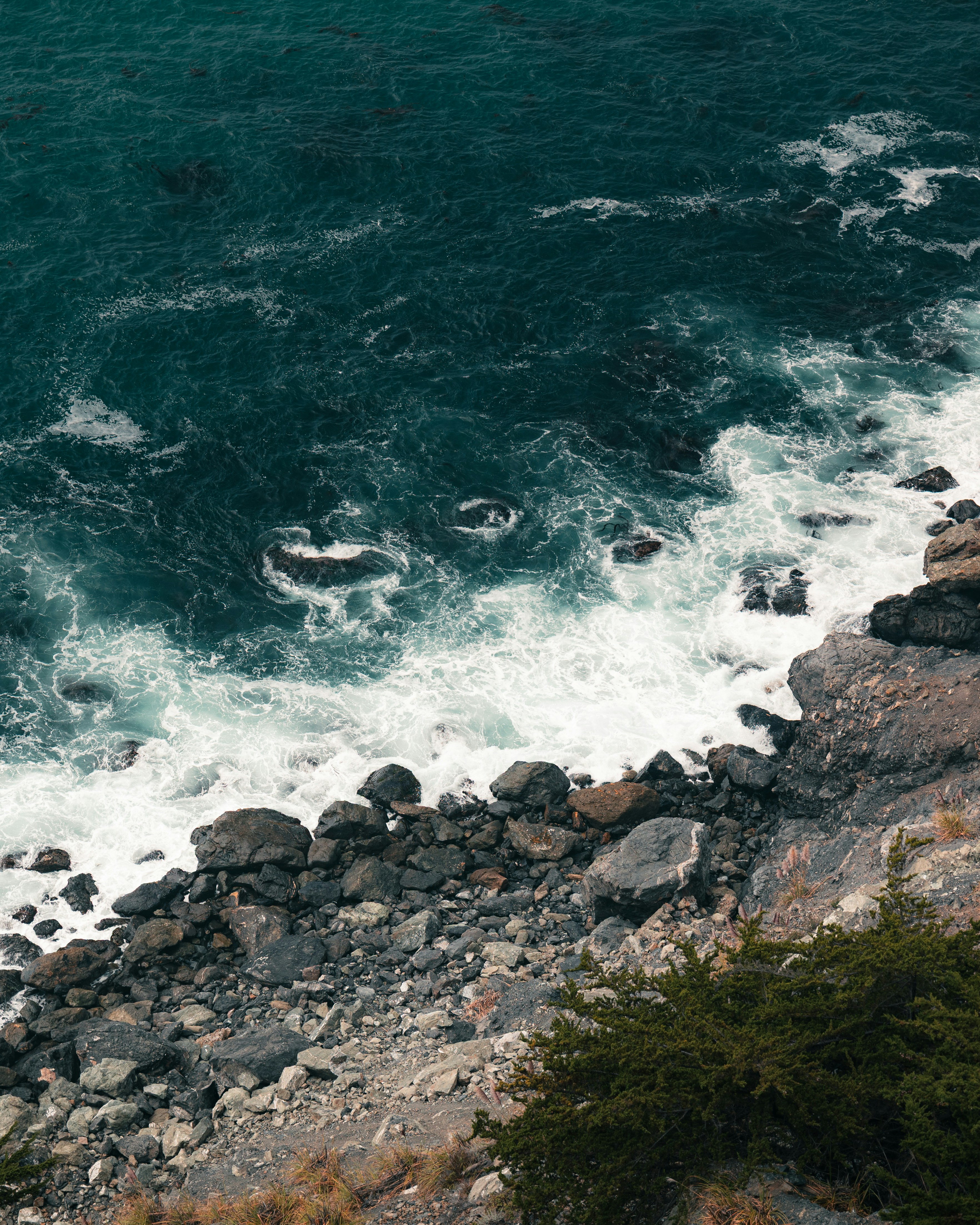Rugged Shoreline against Turquoise Breakers