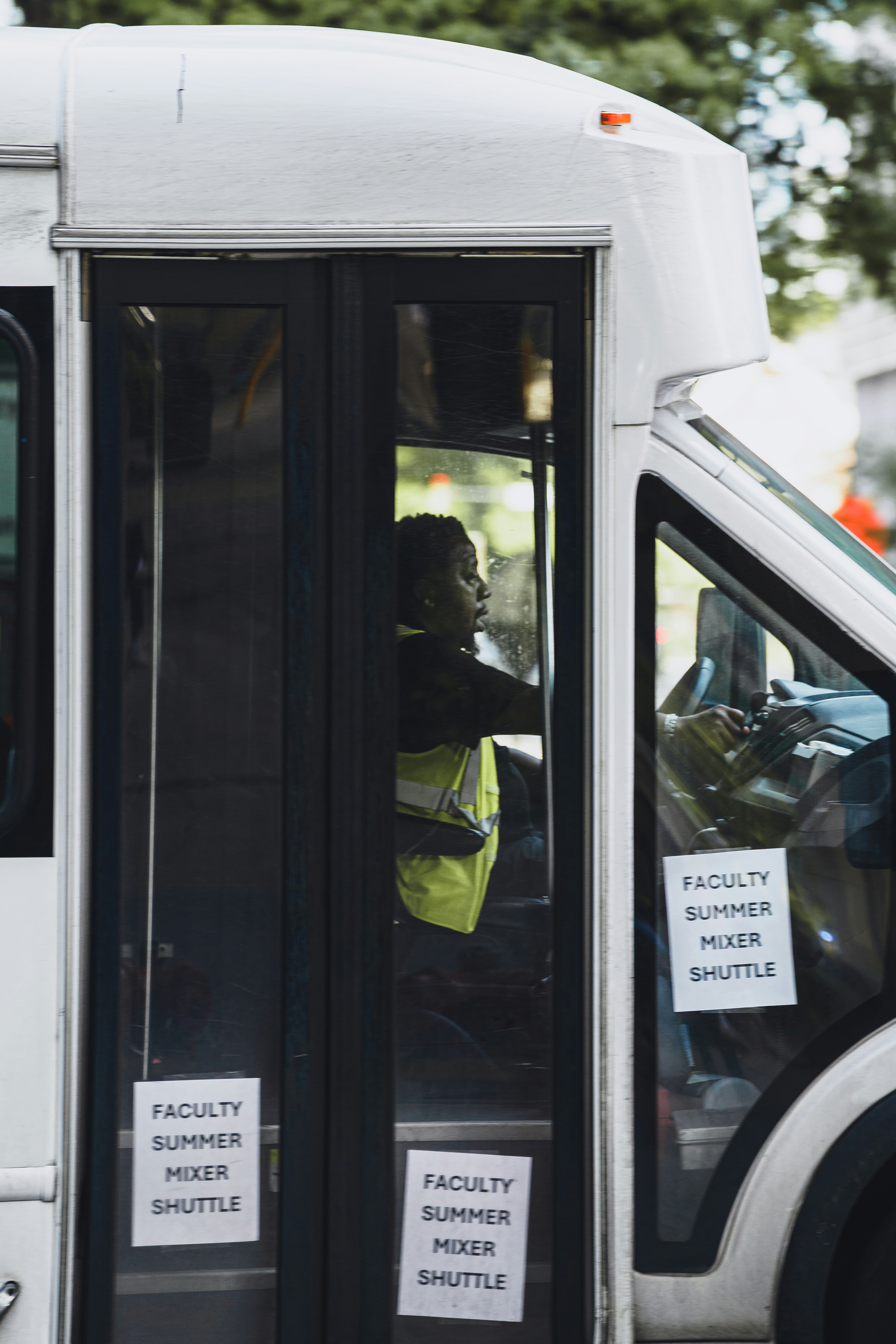 Shuttle Standby: A Driver’s Quiet Moment Inside a Van Cab