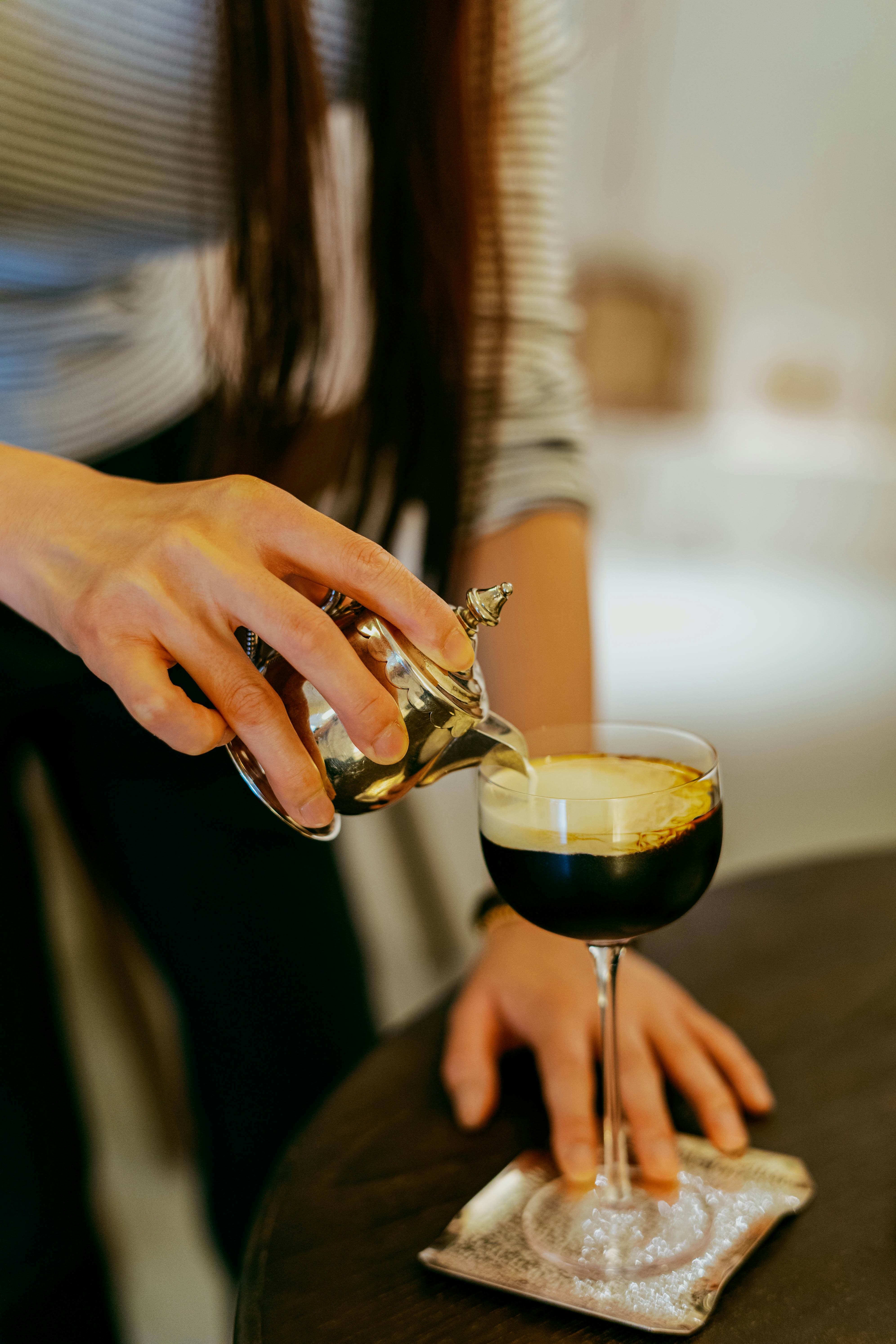 Pouring Precision: A Glass of Nightlife in Focus