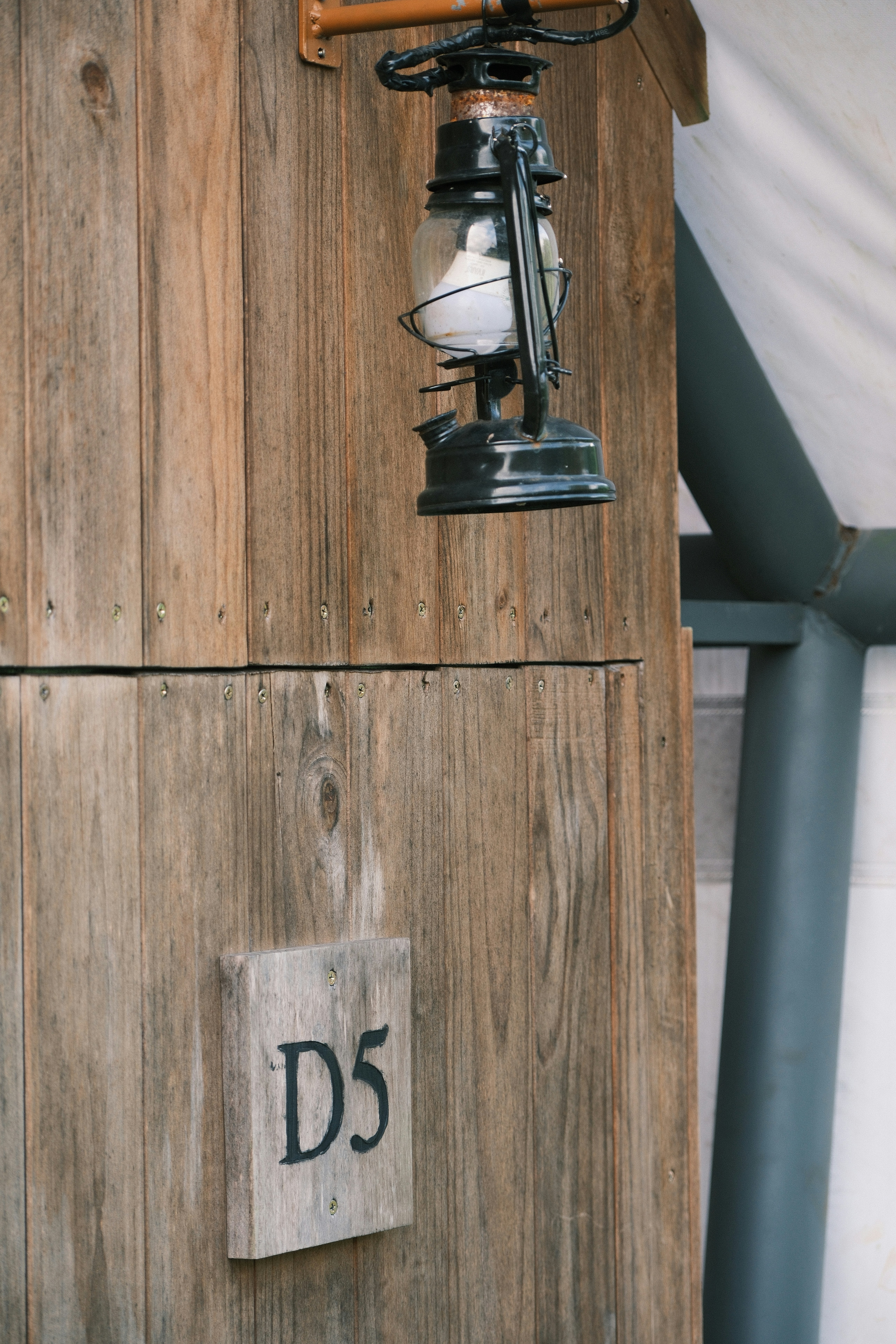 Lantern on Weathered Door: D5 Marked Cabin