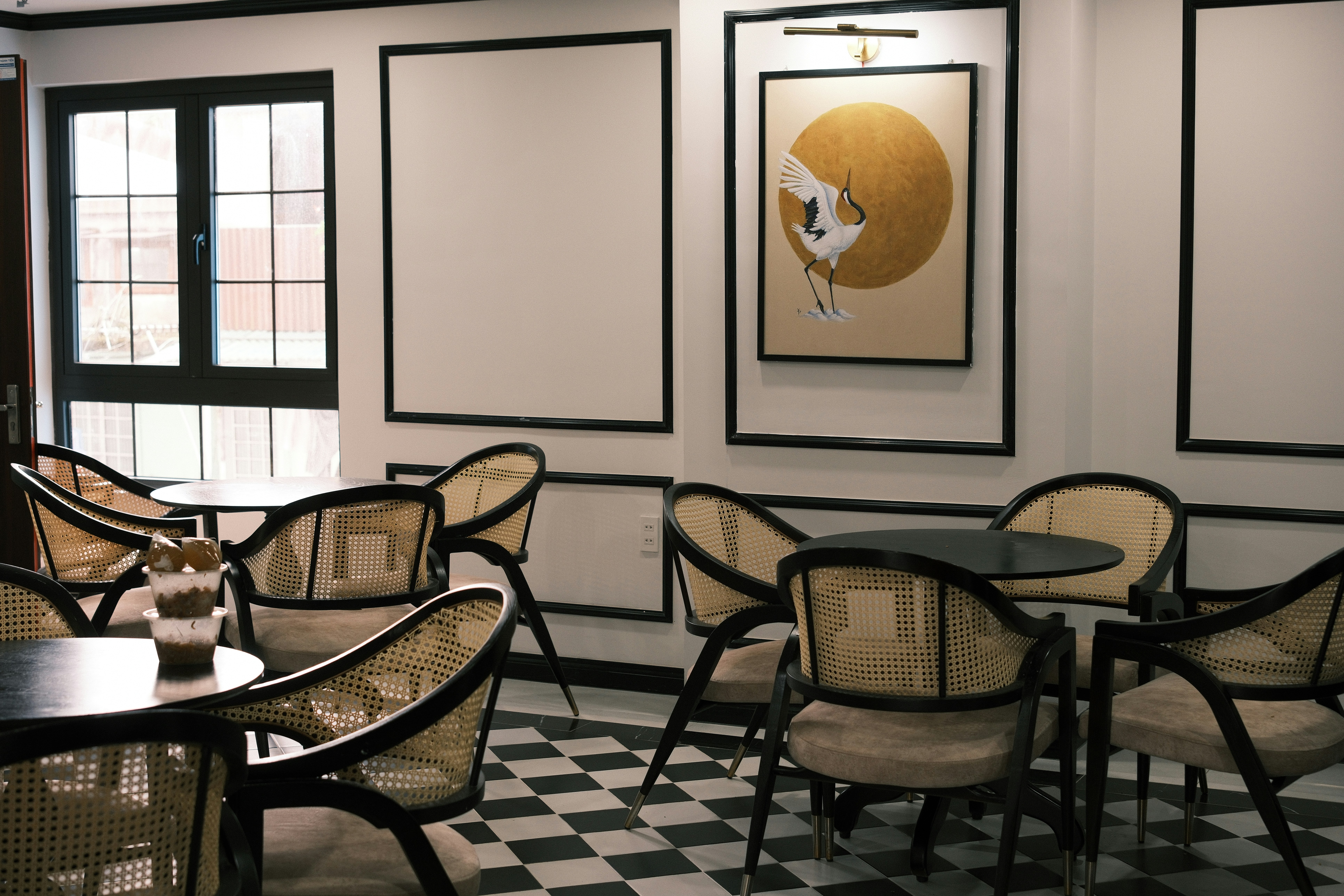 Quiet Corner Café: Framed Art and Empty Tables