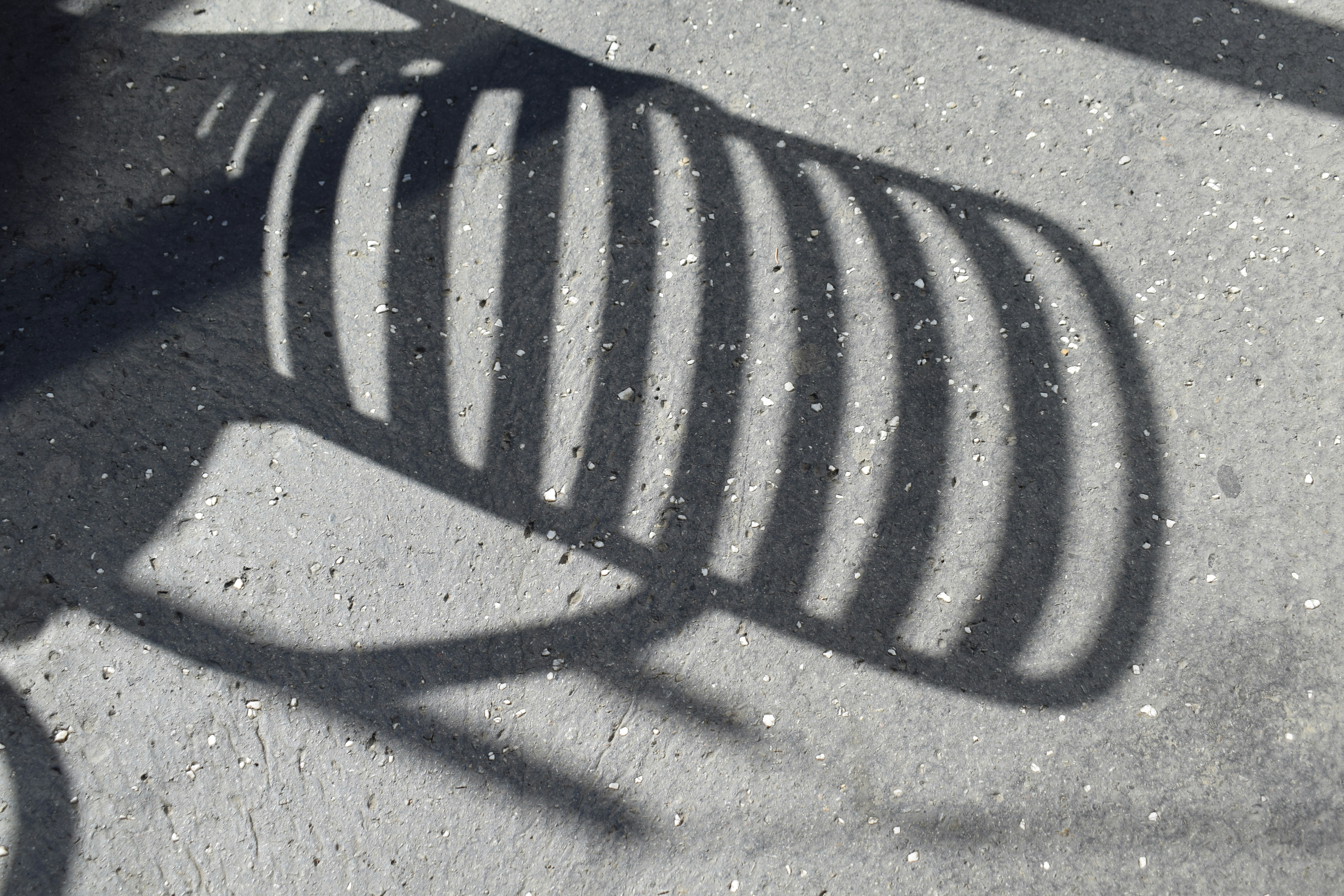 Shadowed Spiral: A Footprint of Light on Concrete