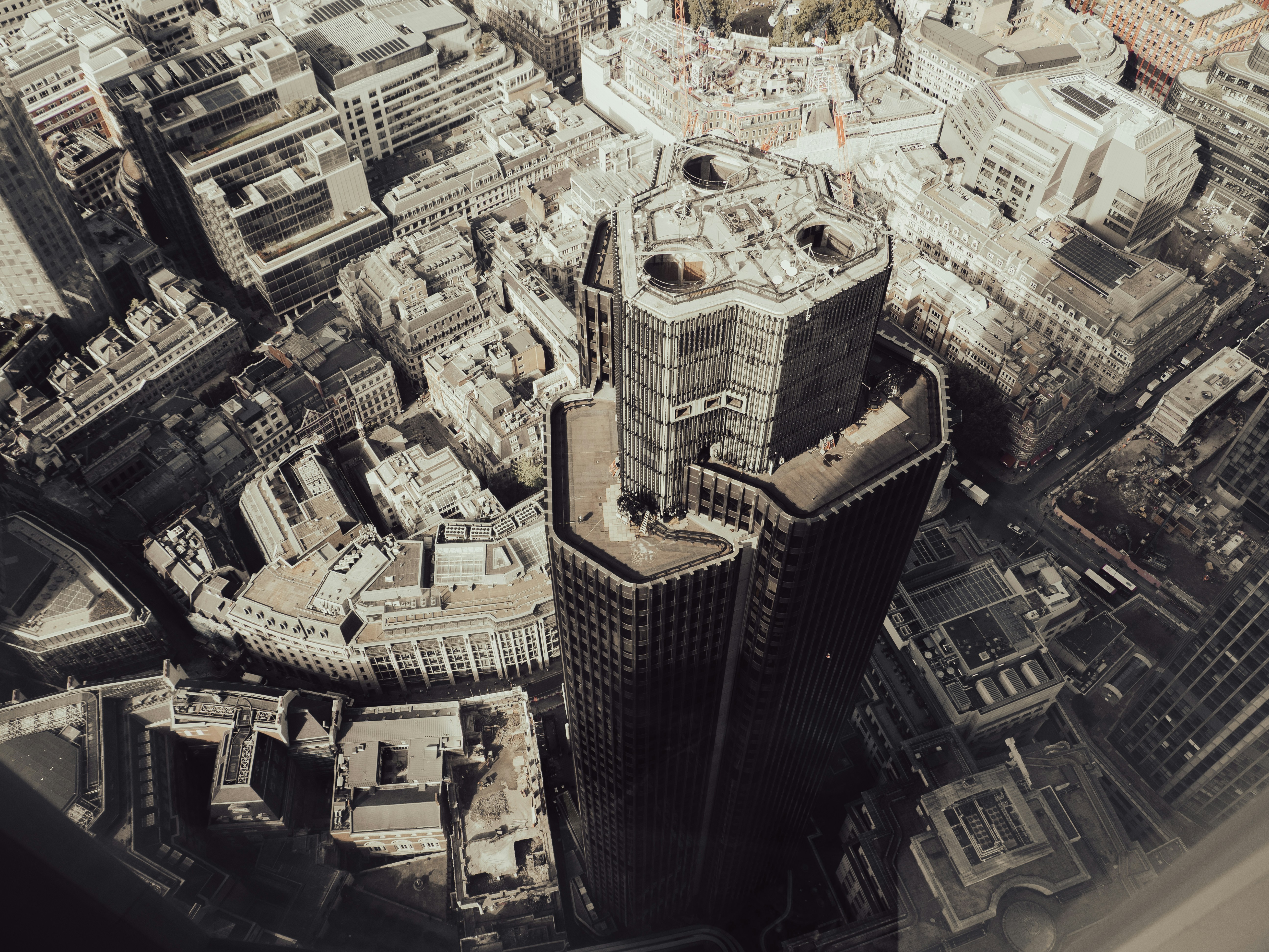 Urban Needle: Aerial Silence Over a Sunlit City Core