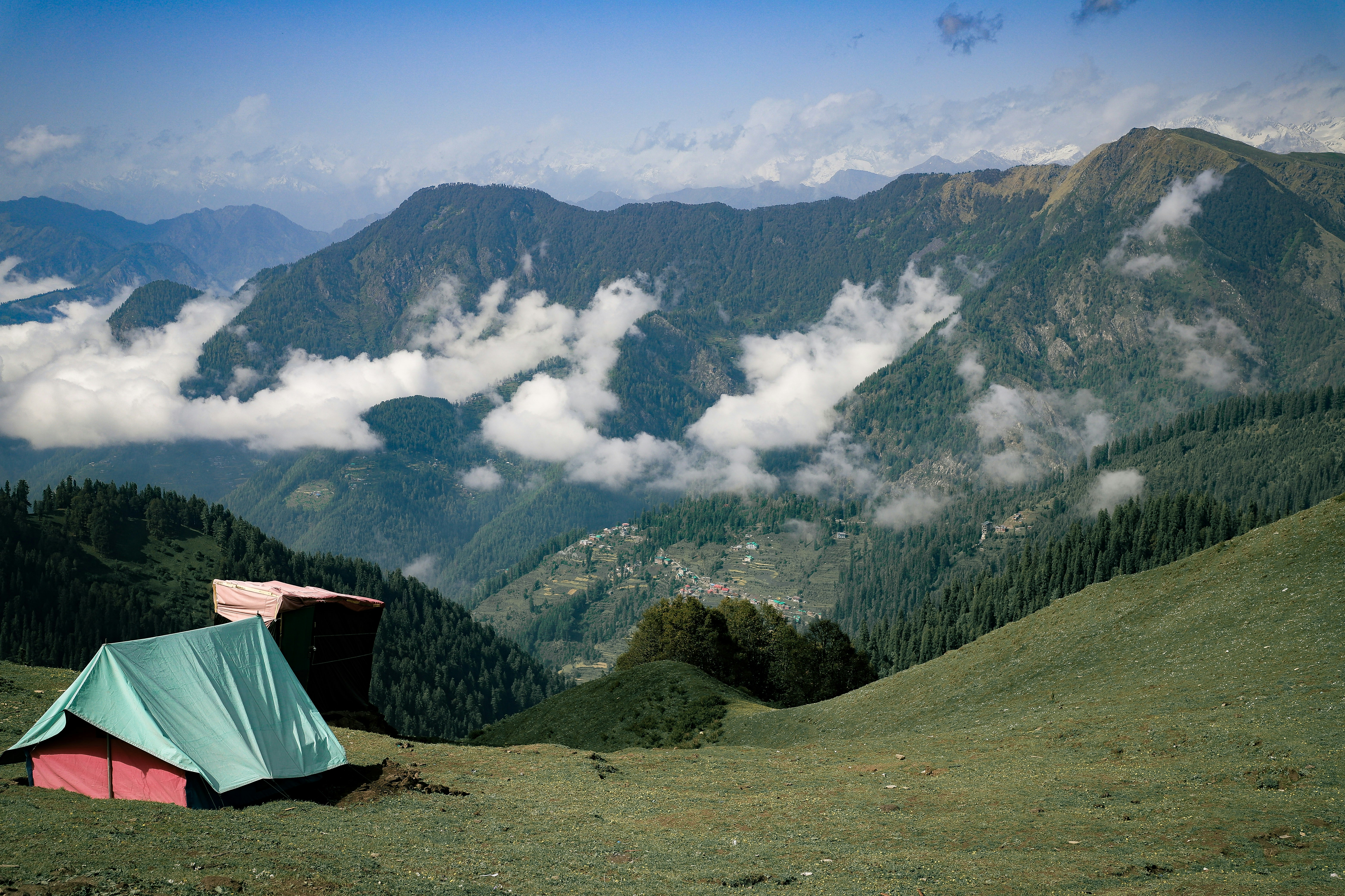 Campsite Veiled by Alpine Mist Beneath Ringed Peaks