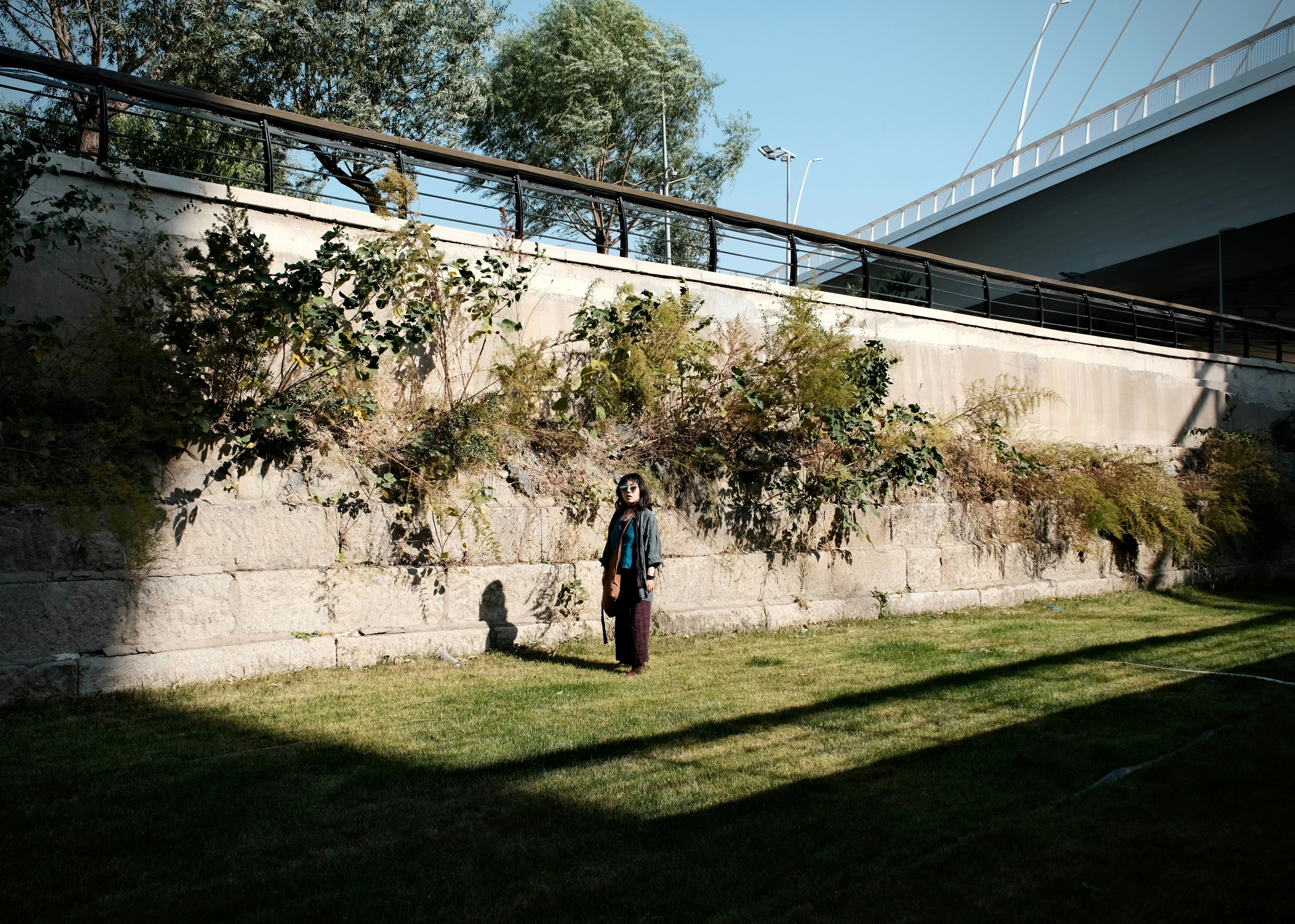 Solitary Figure under the Overpass