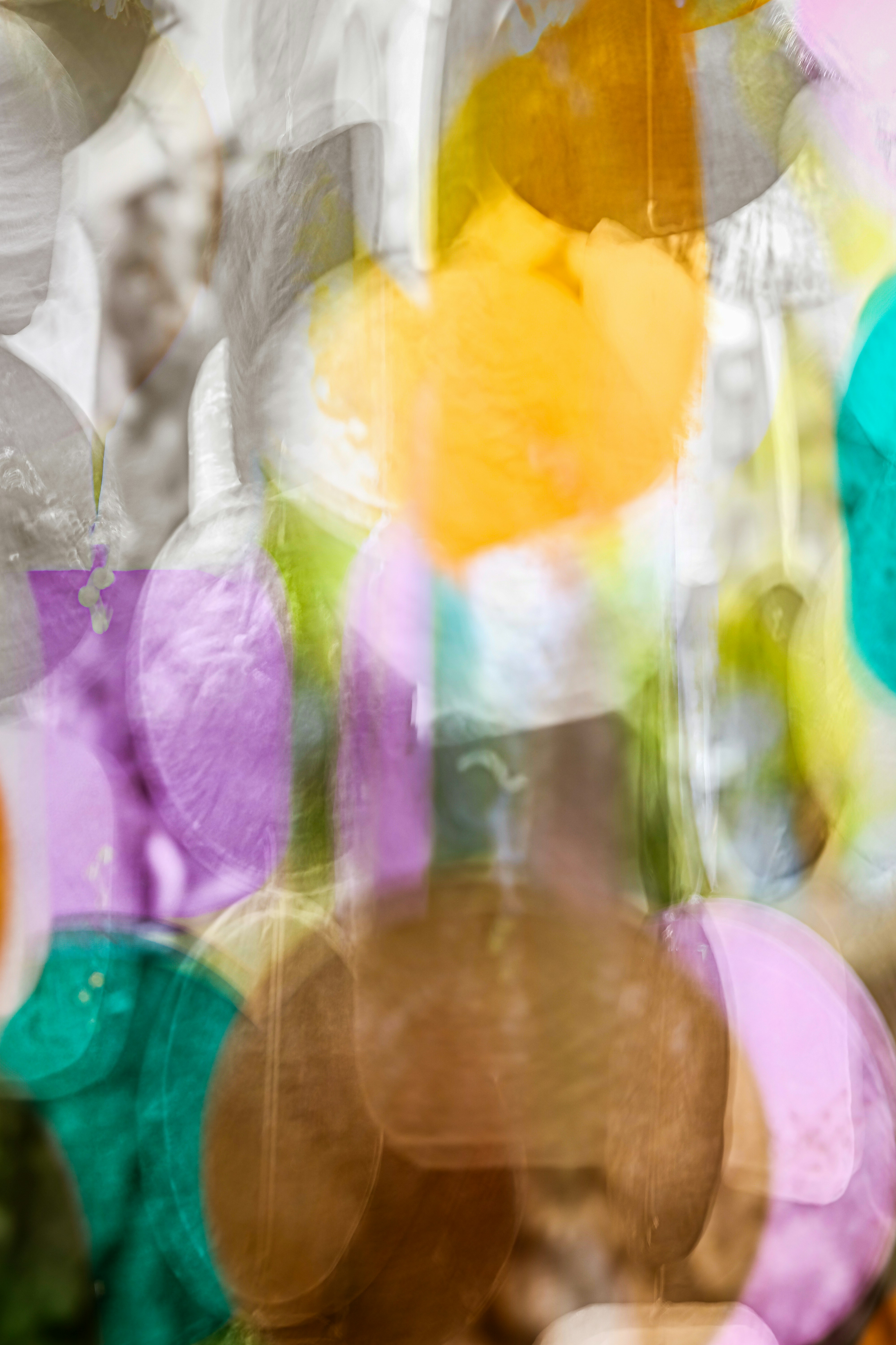 Prismatic Haze: Blurred Orbs of Color as People Move Through Floating Lanterns