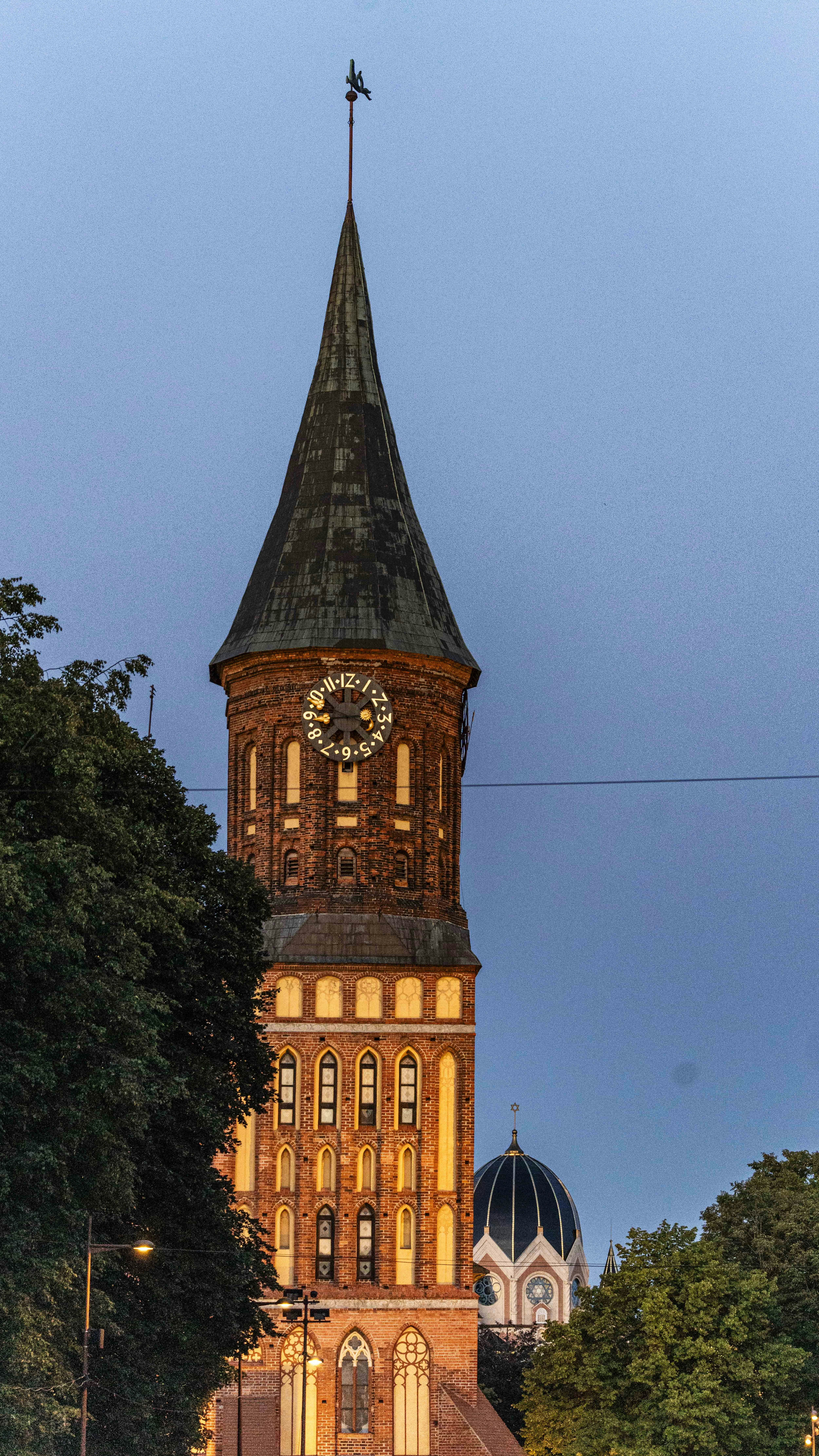 Clocktower at Dusk: Brickwork and Spire Reaching into the Sky