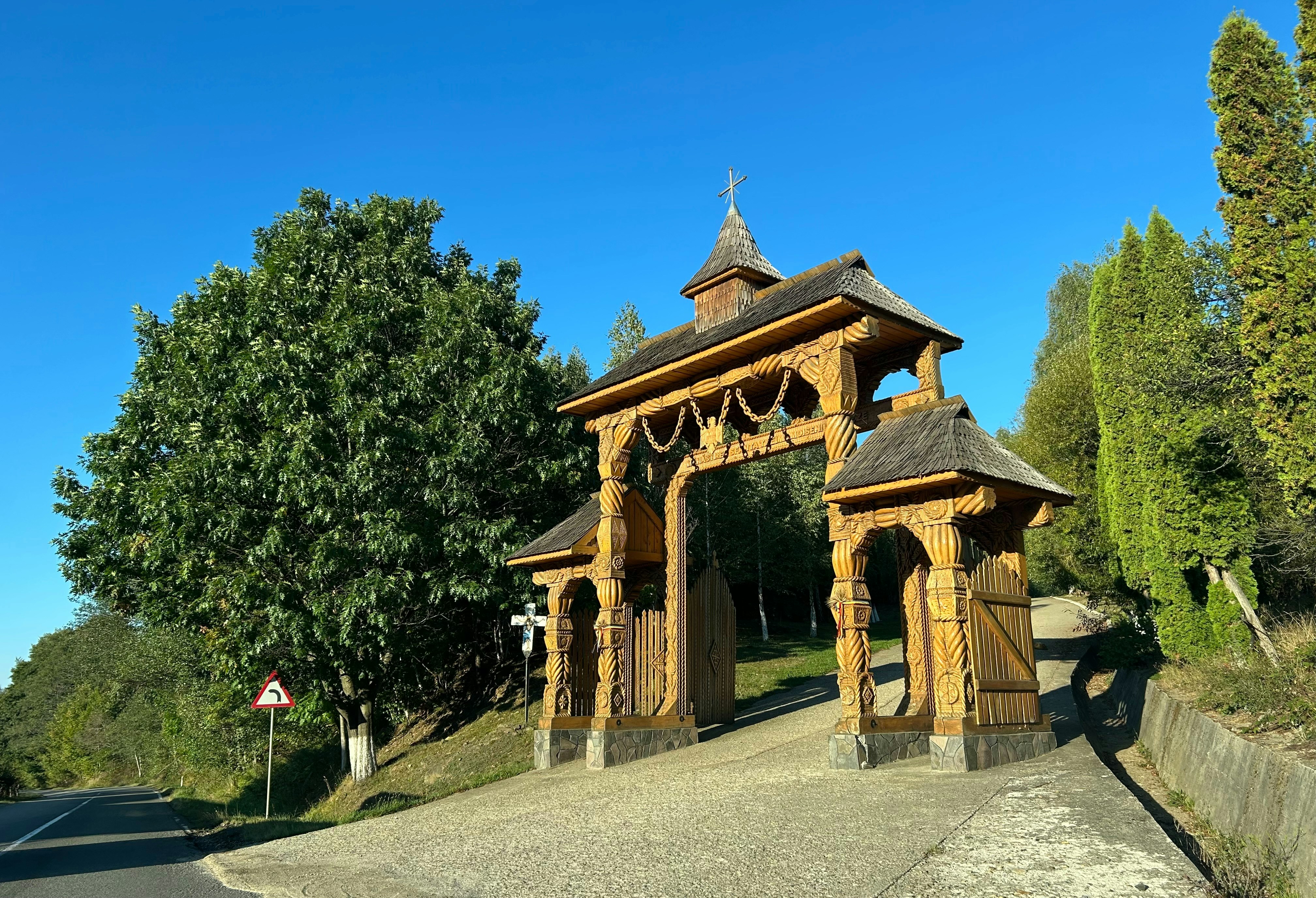The Carved Gateway Over a Gravel Path