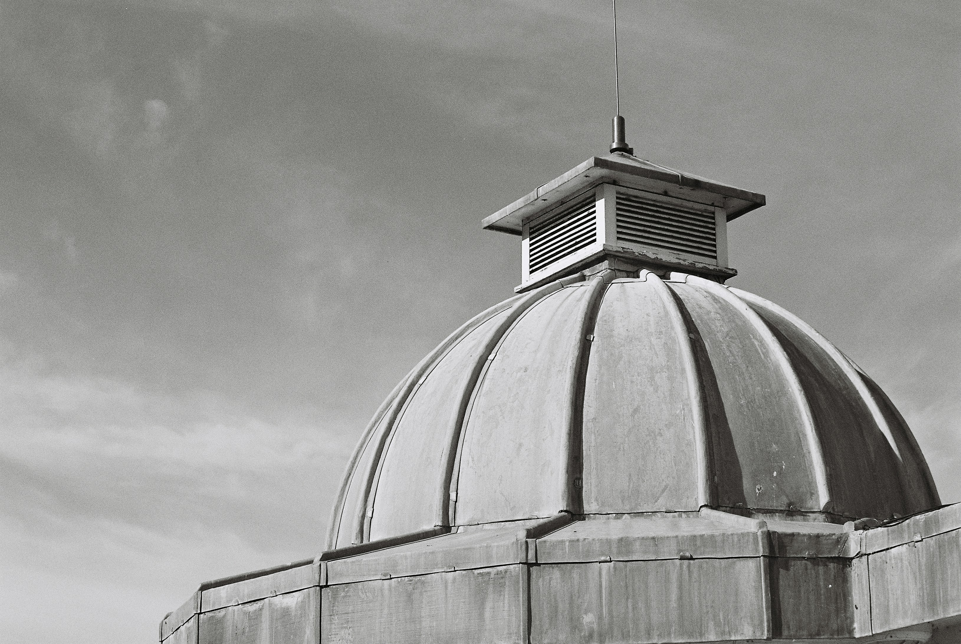 Dome Summit: A Quiet Cylindrical Crest Under Soft Skies