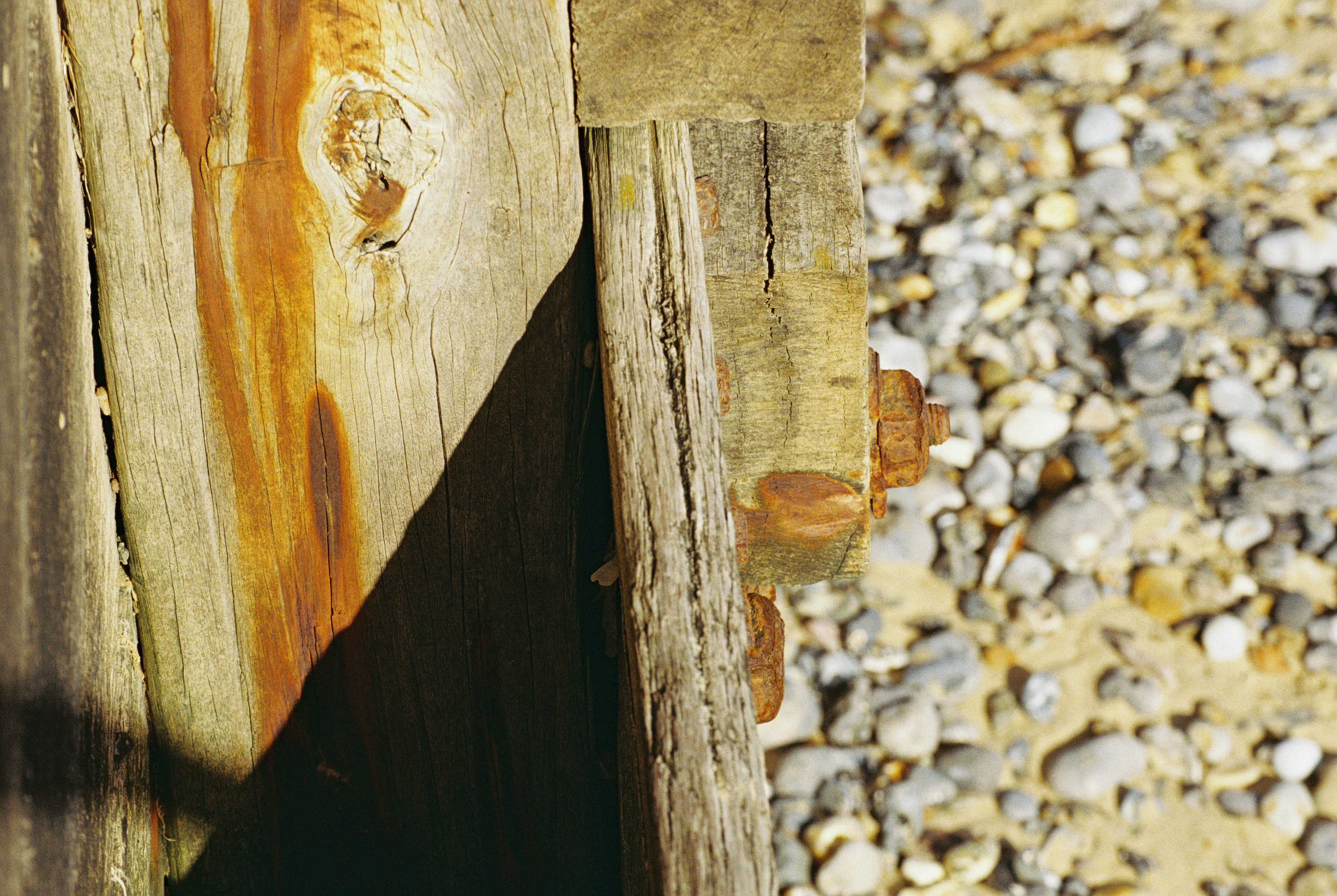 Weathered Timber at the Edge of Pebble Ground