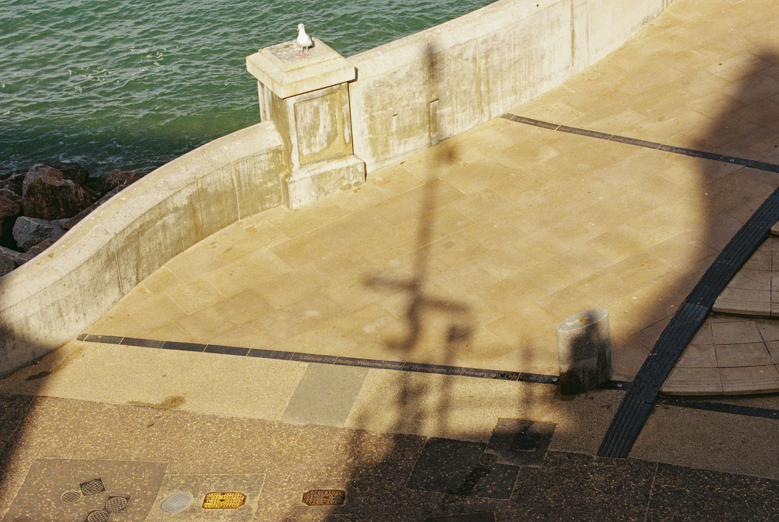 Shadowed Promenade Overlooking the Sea