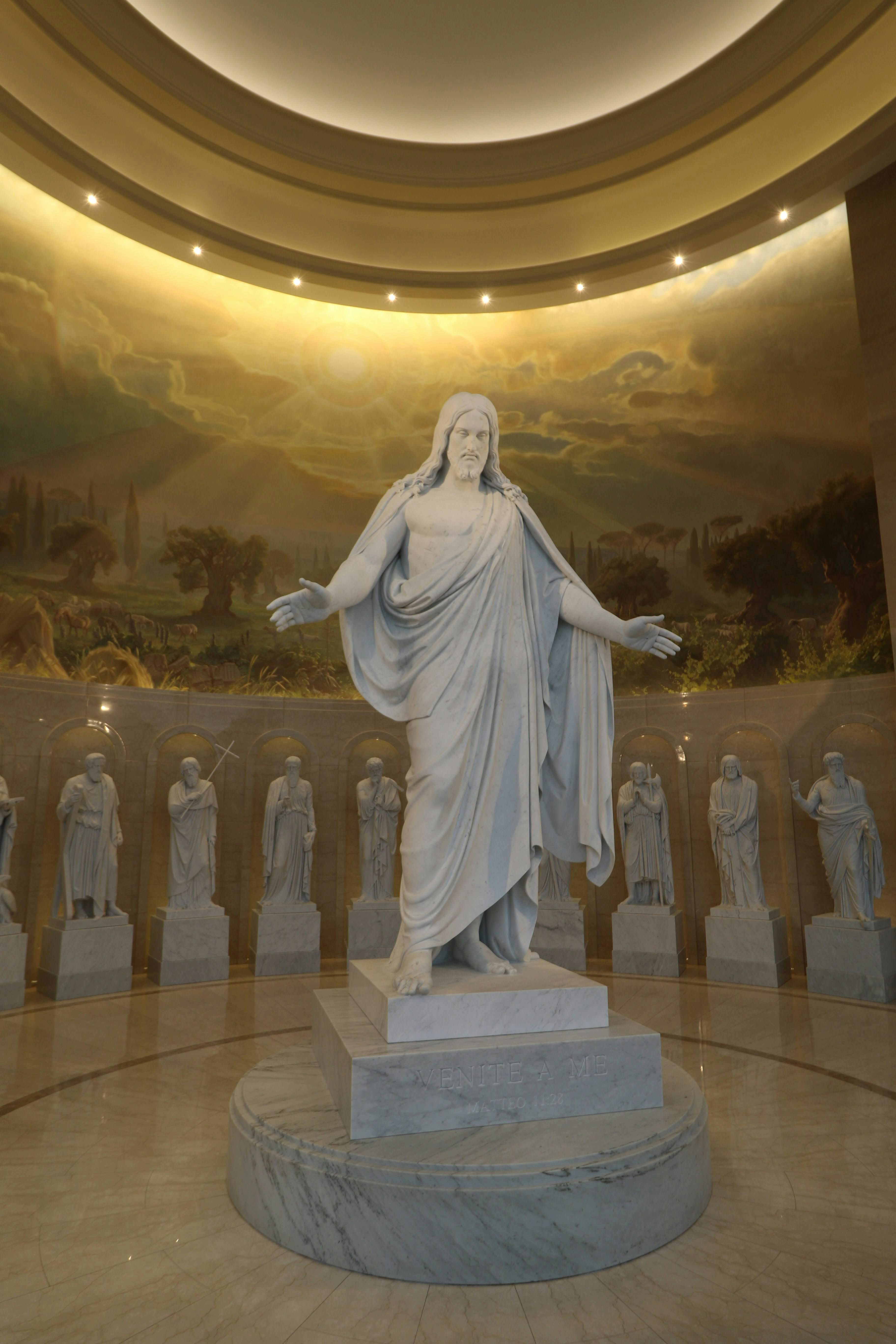 The Embrace of Marble: A Central Christ statue within a dome of light
