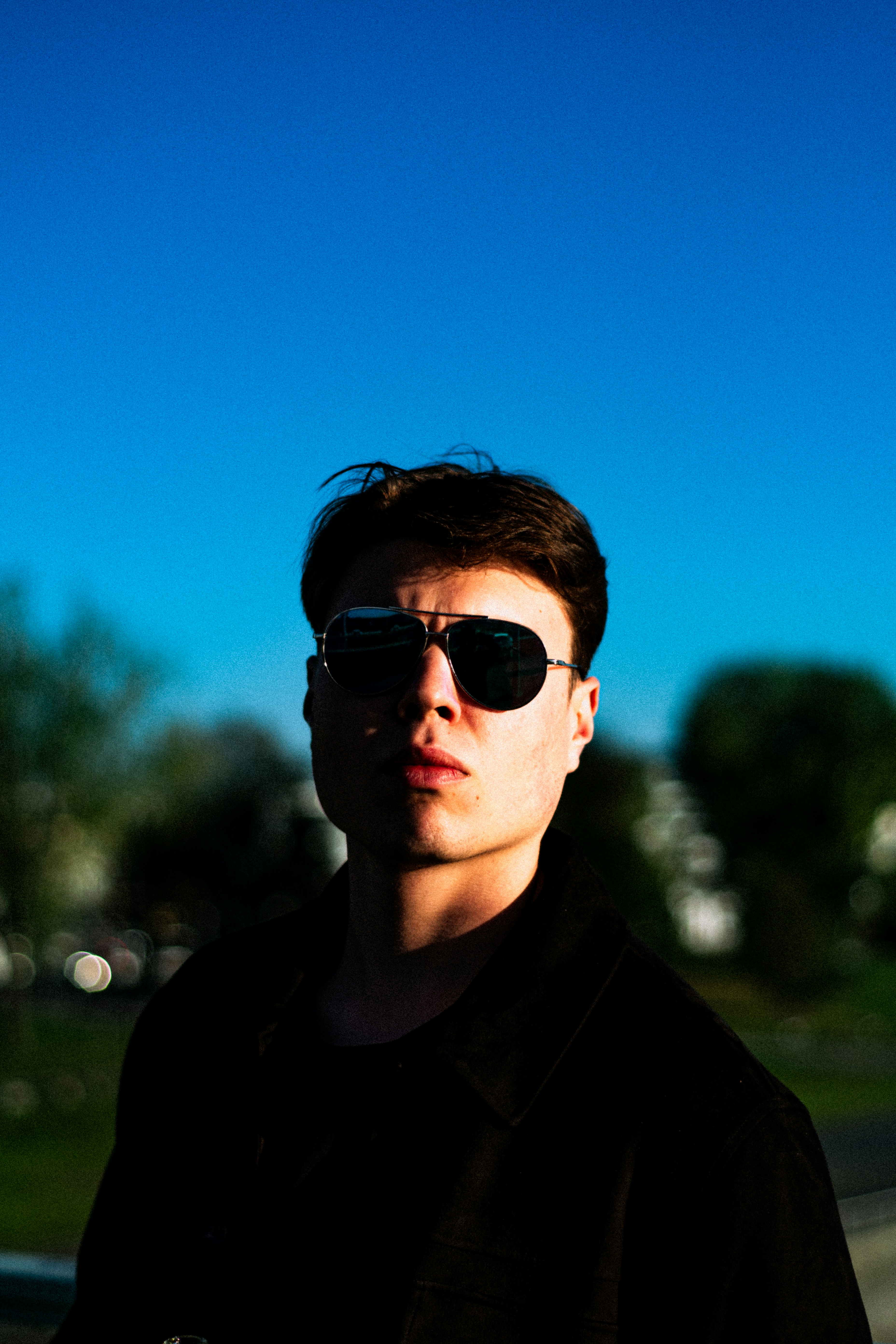 Shadowed Resolve: A Portrait in Bold Blue Light