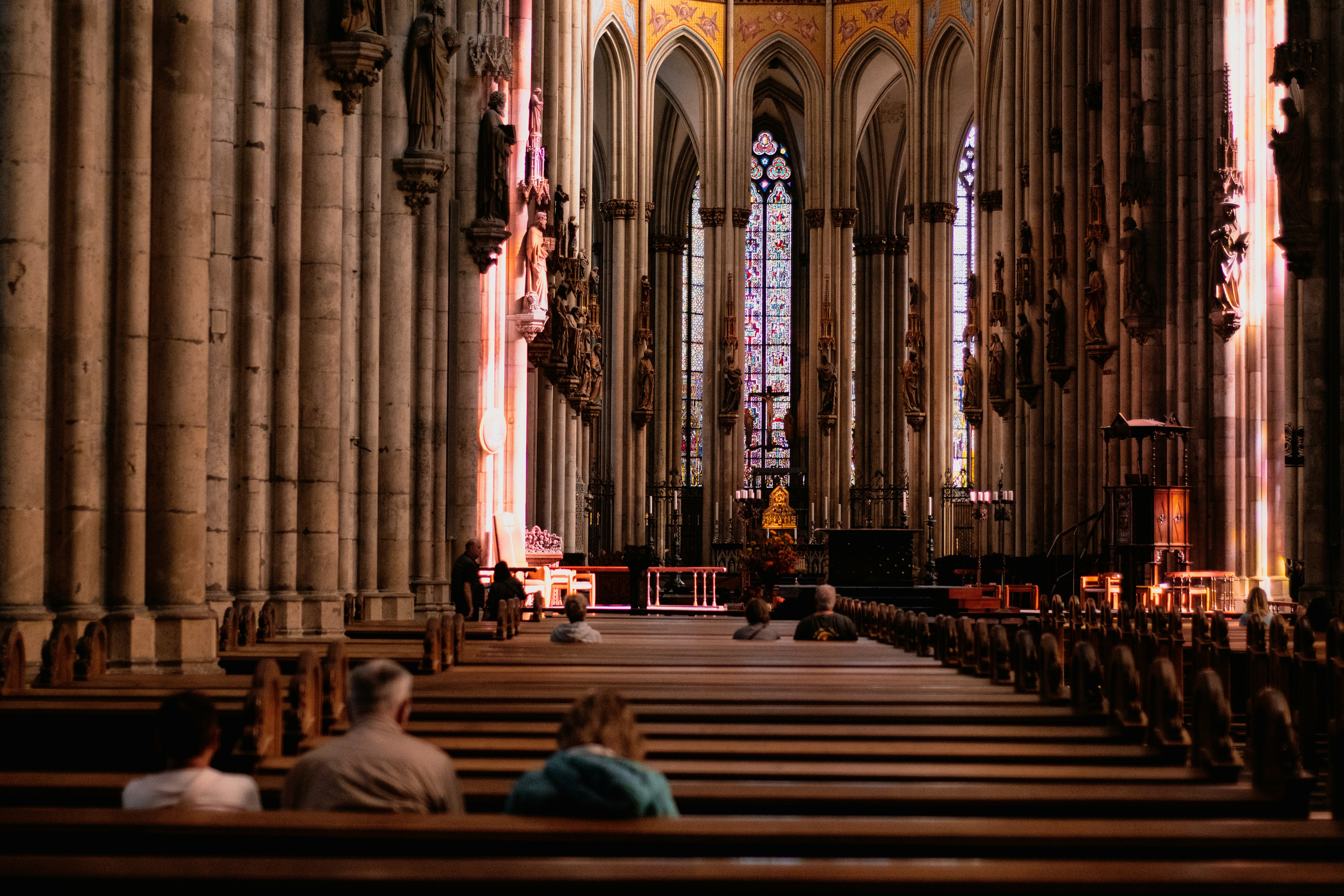 Hushed Awe Under Stained Glass Arches
