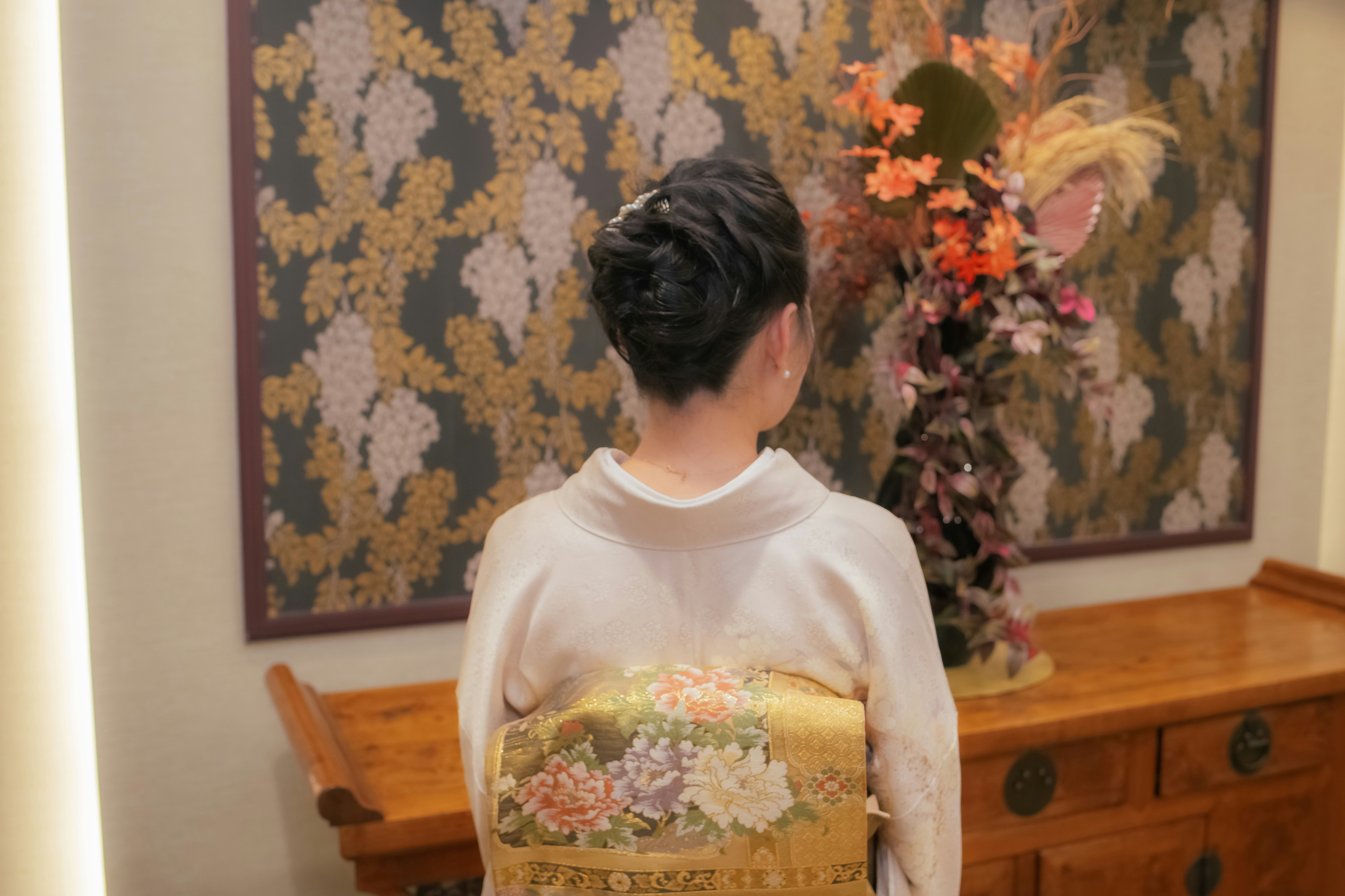 Back-View in a Floral Kimono Amid Vintage Interior