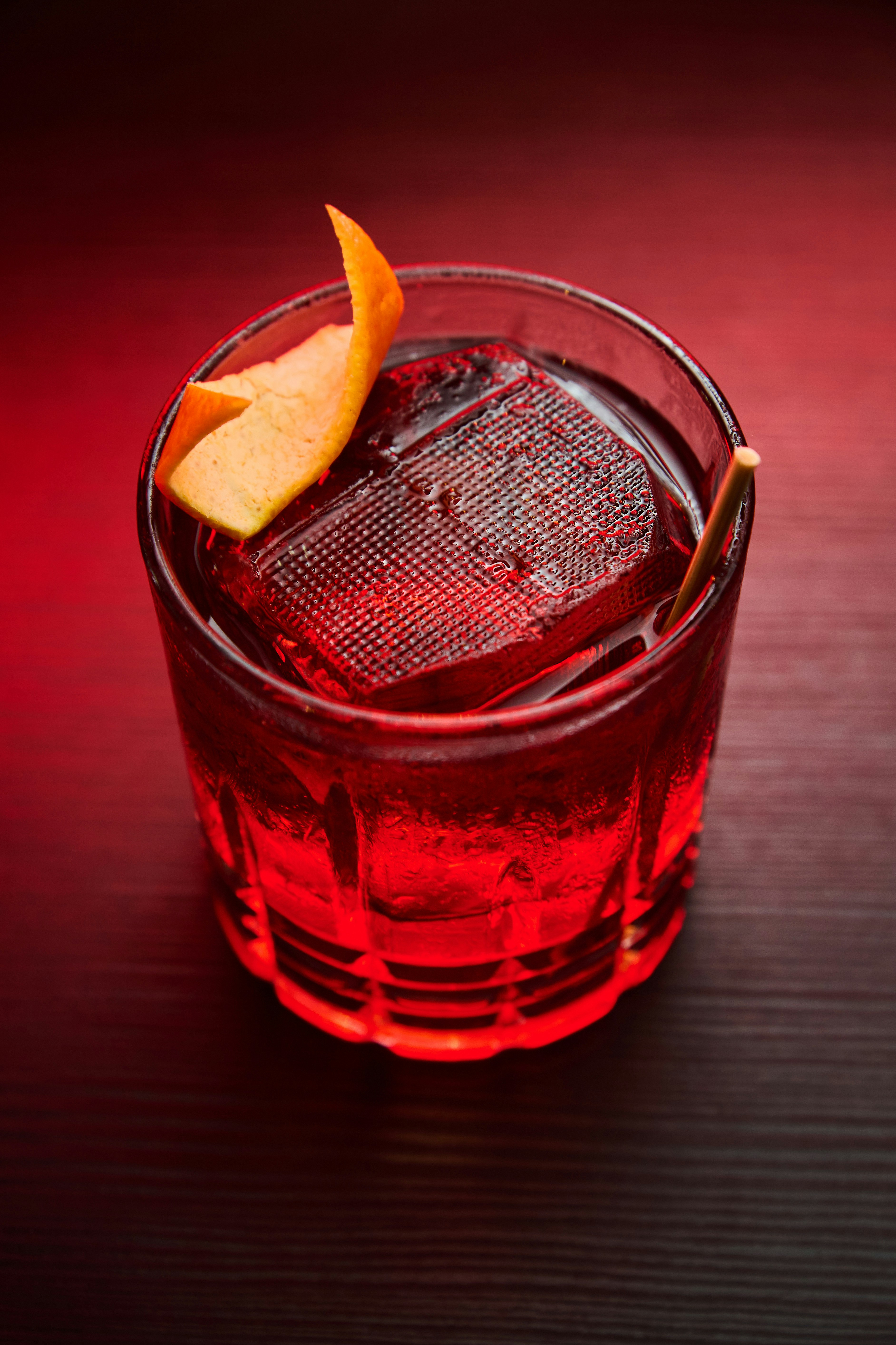 Crimson Sip: A Glass of Midnight Citrus