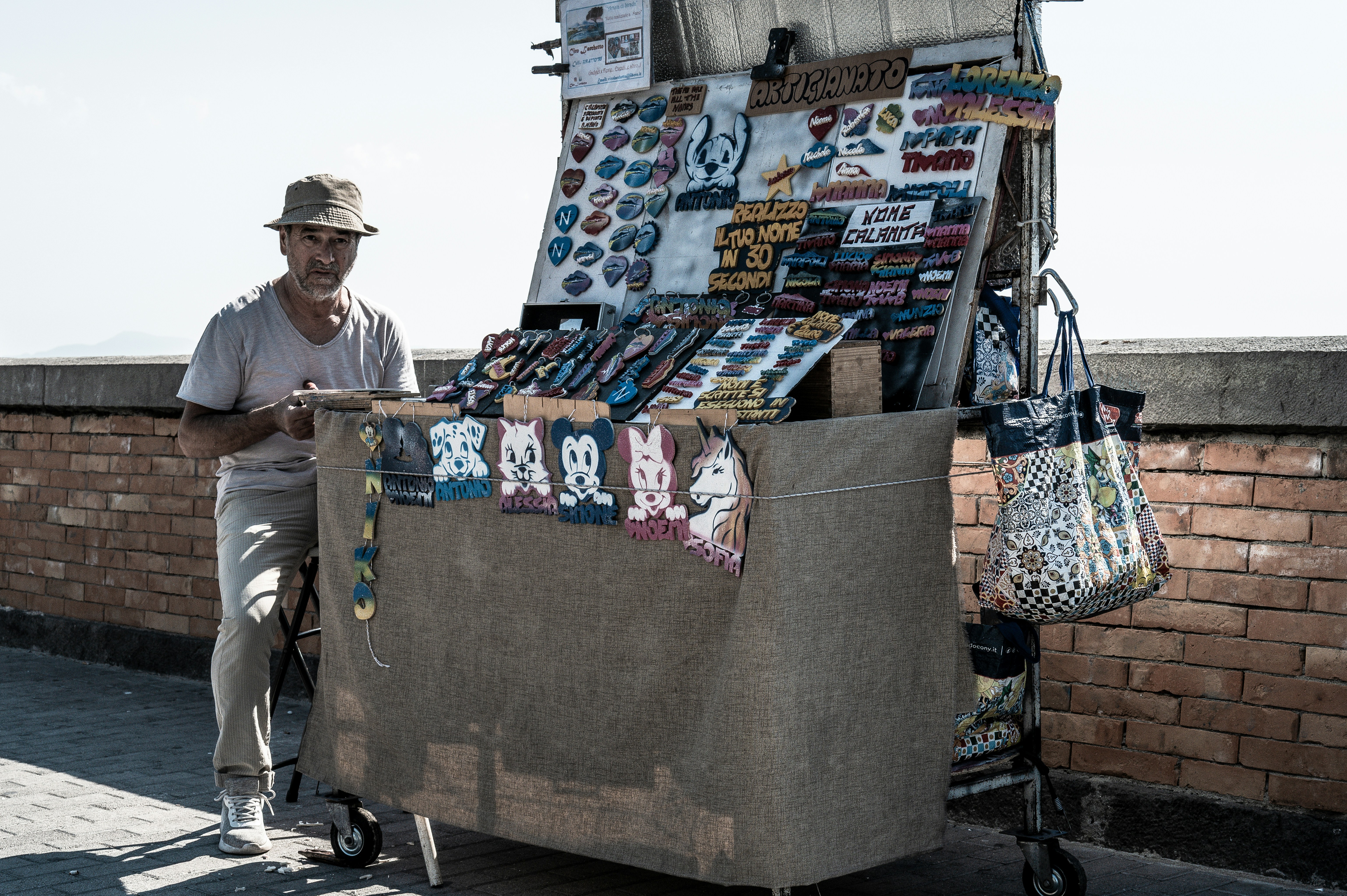 The Wagon-Street Vendor: A Quiet Moment with Colorful Ephemera