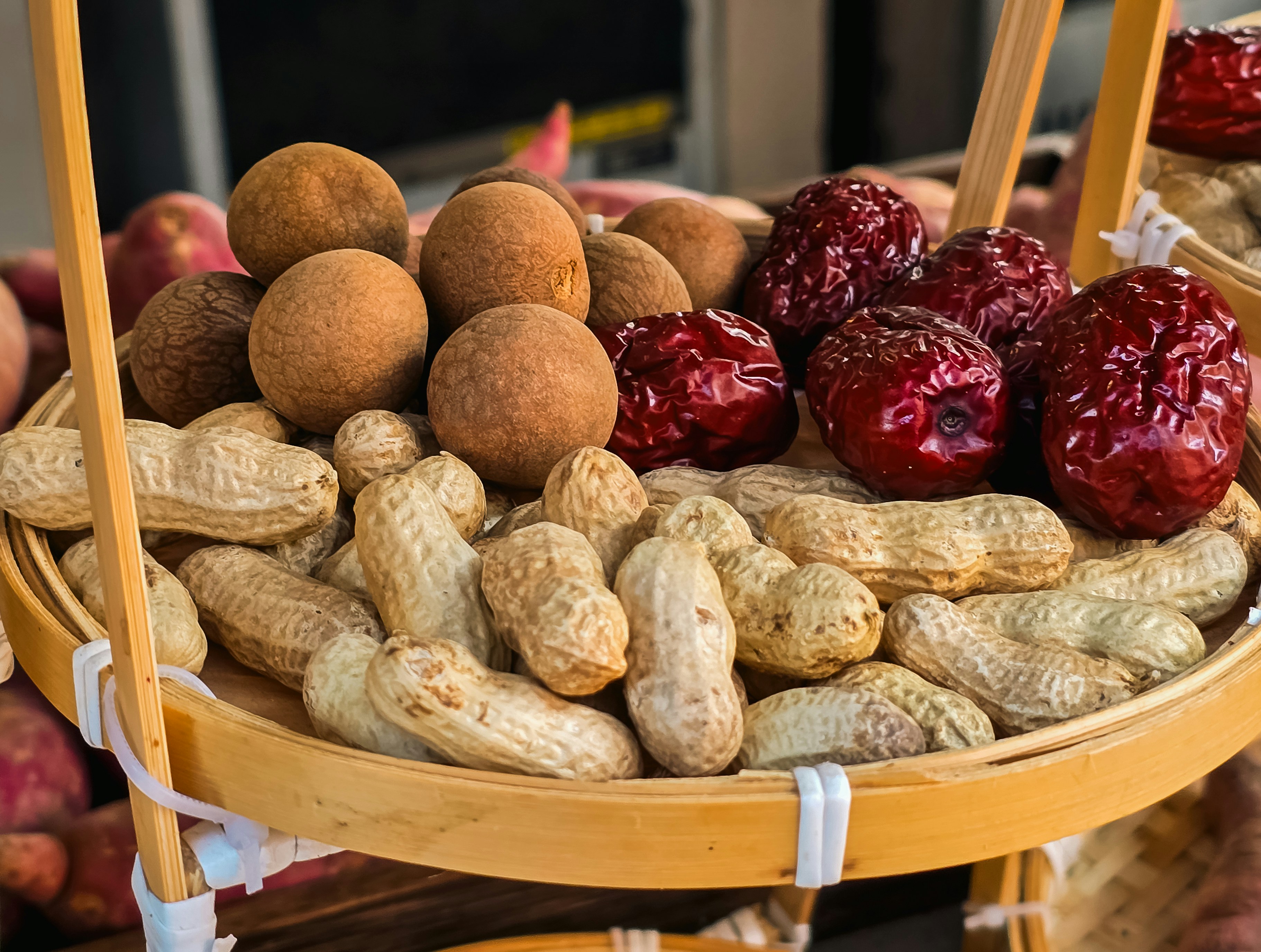 Basket of Peanuts and Red Dates: A Close-Up of Earthy Harvest