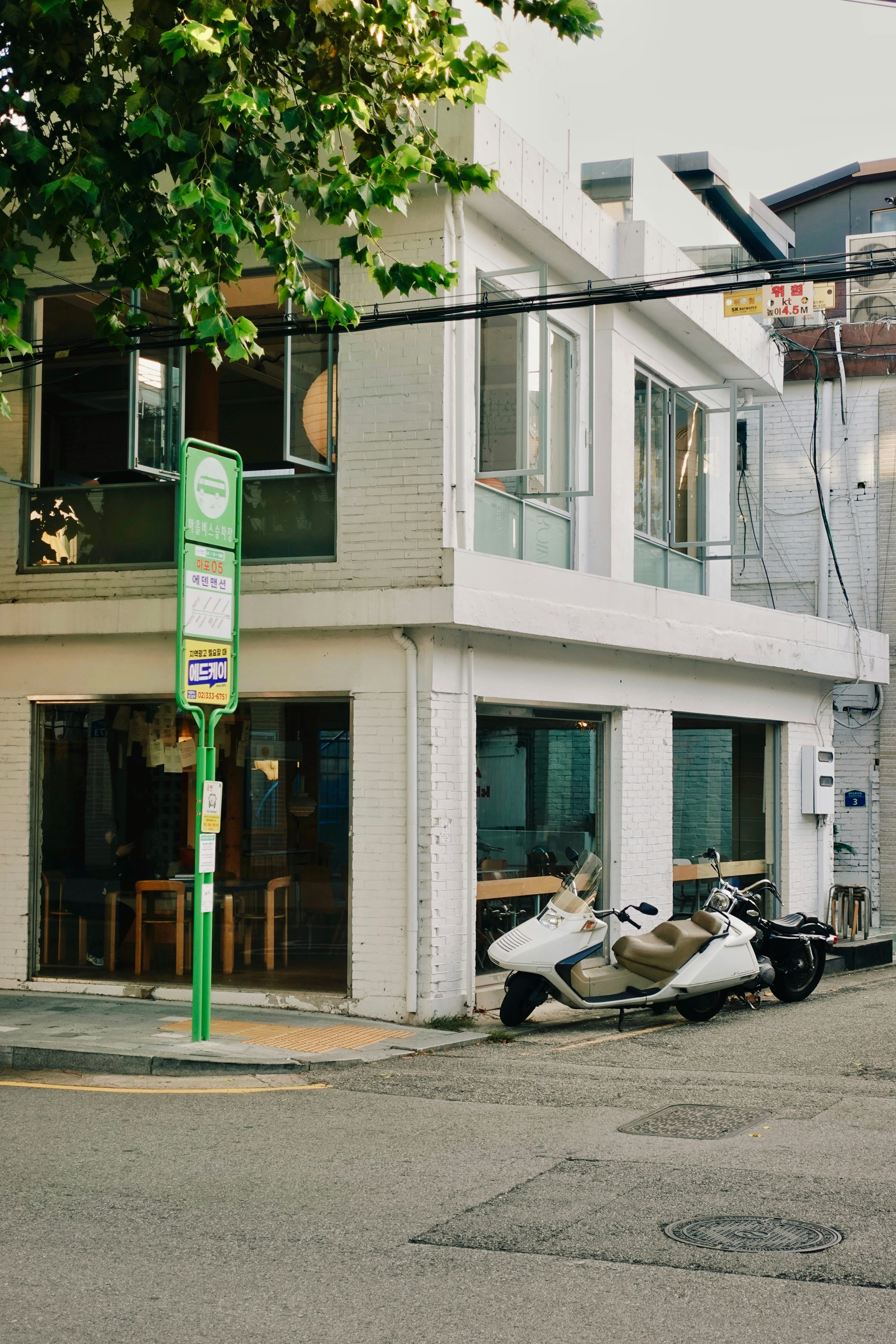 Scooter Silence on a Sunlit Street