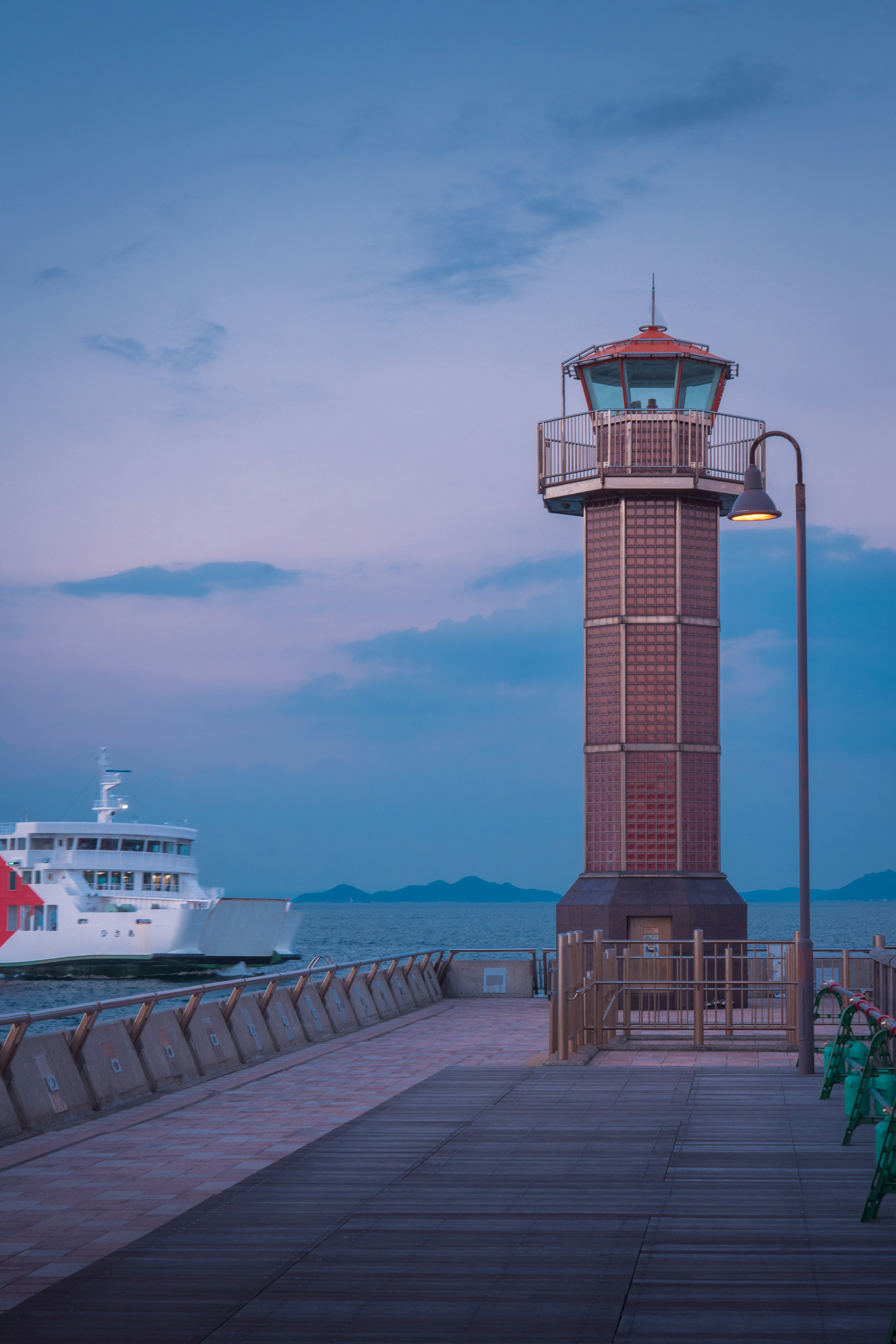 Lighthouse Sentinel at Dusk by the Pier