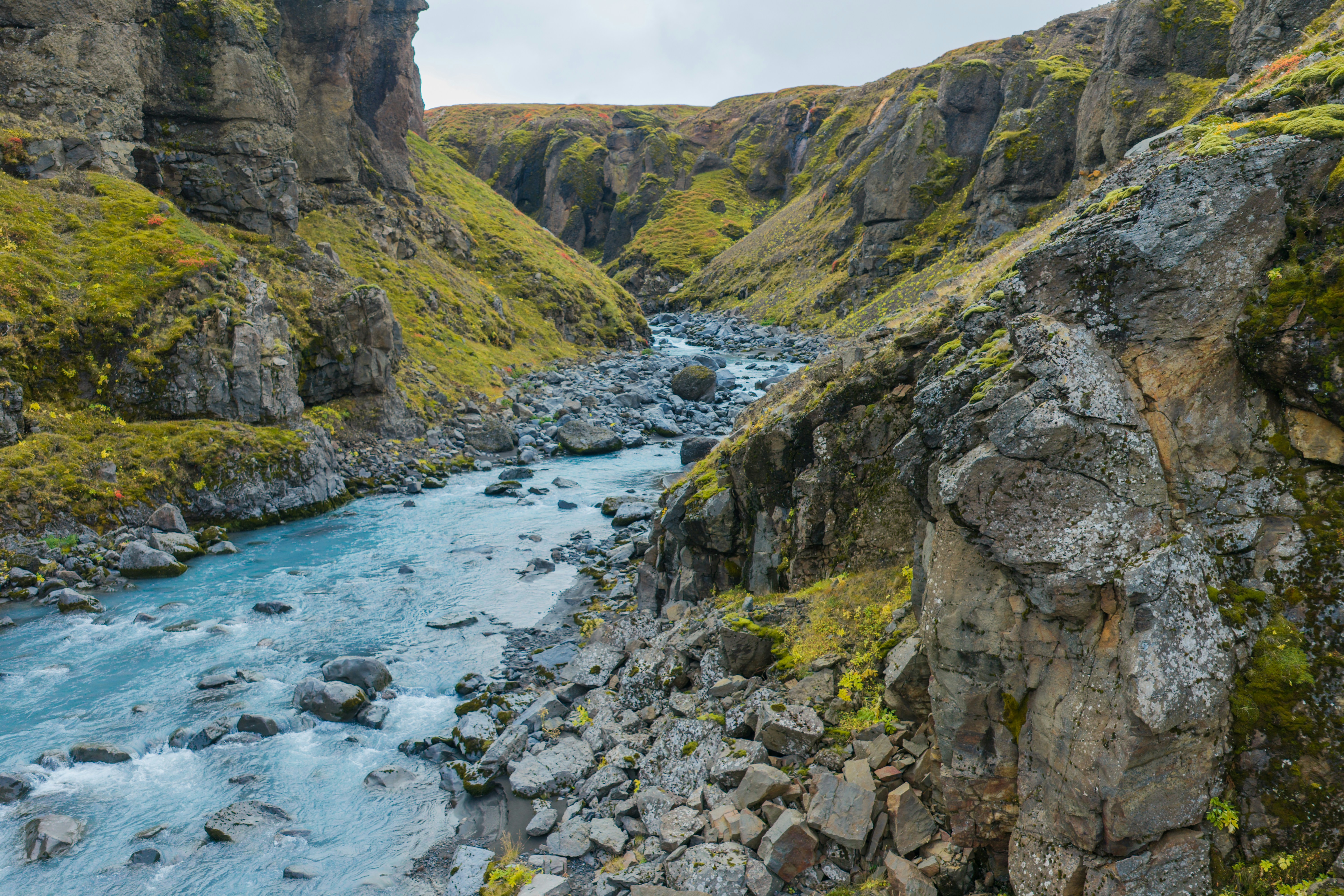 Icy Aerie: A Turquoise River Winds Through Mossy Gorges