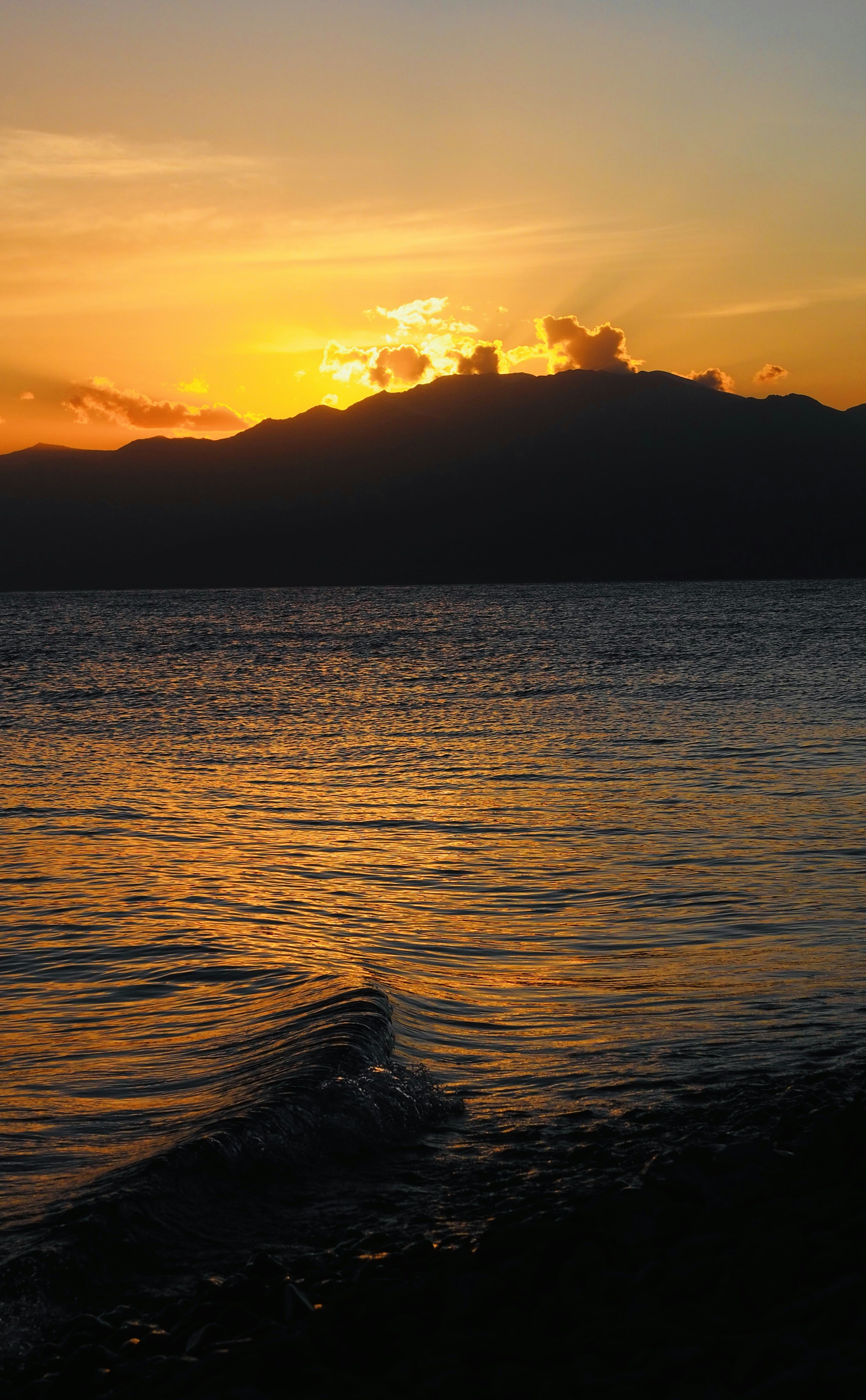 Golden Peak over Quiet Waters at Dusk