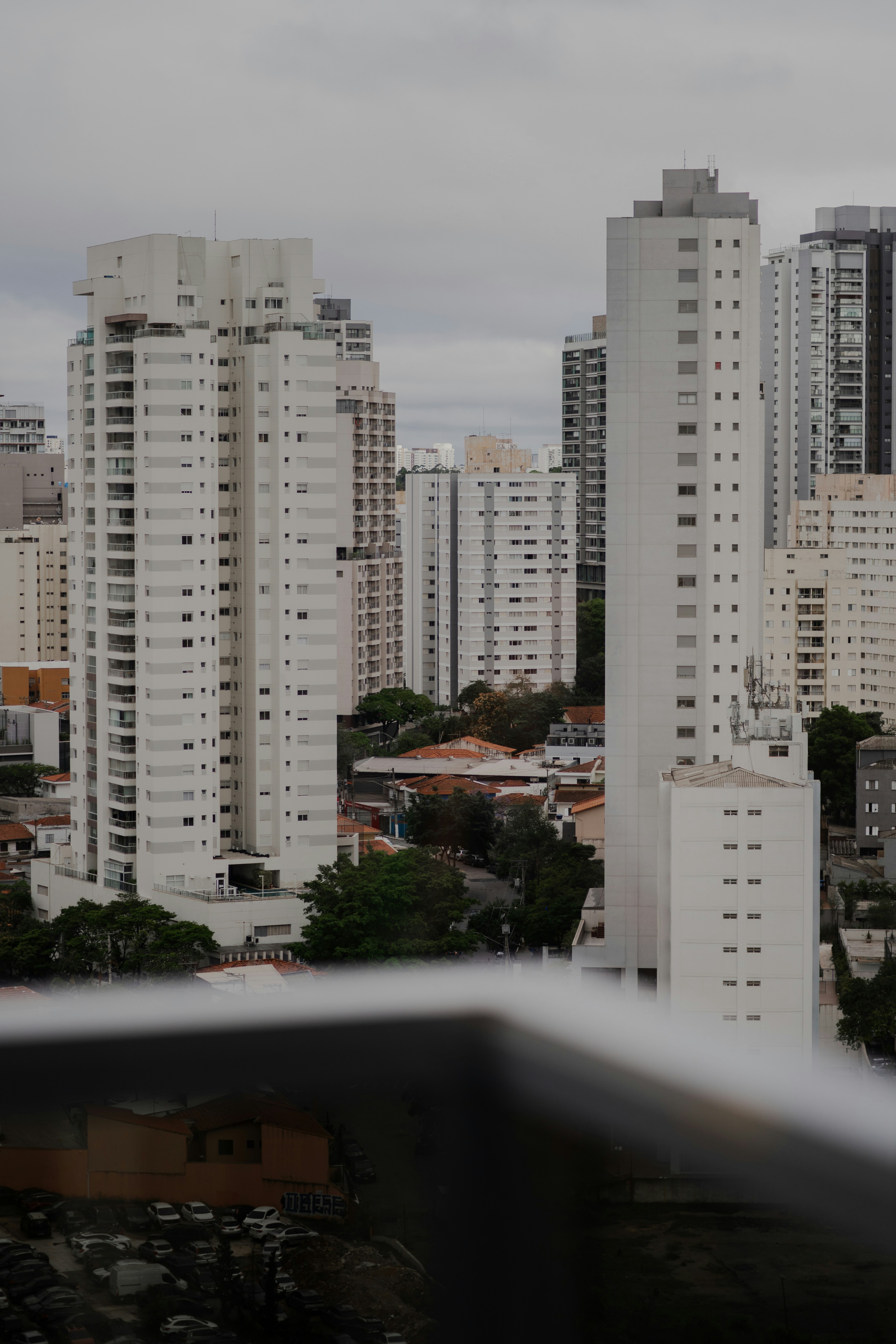 Urban Cascade: Towers Reaching Toward a Overcast Sky